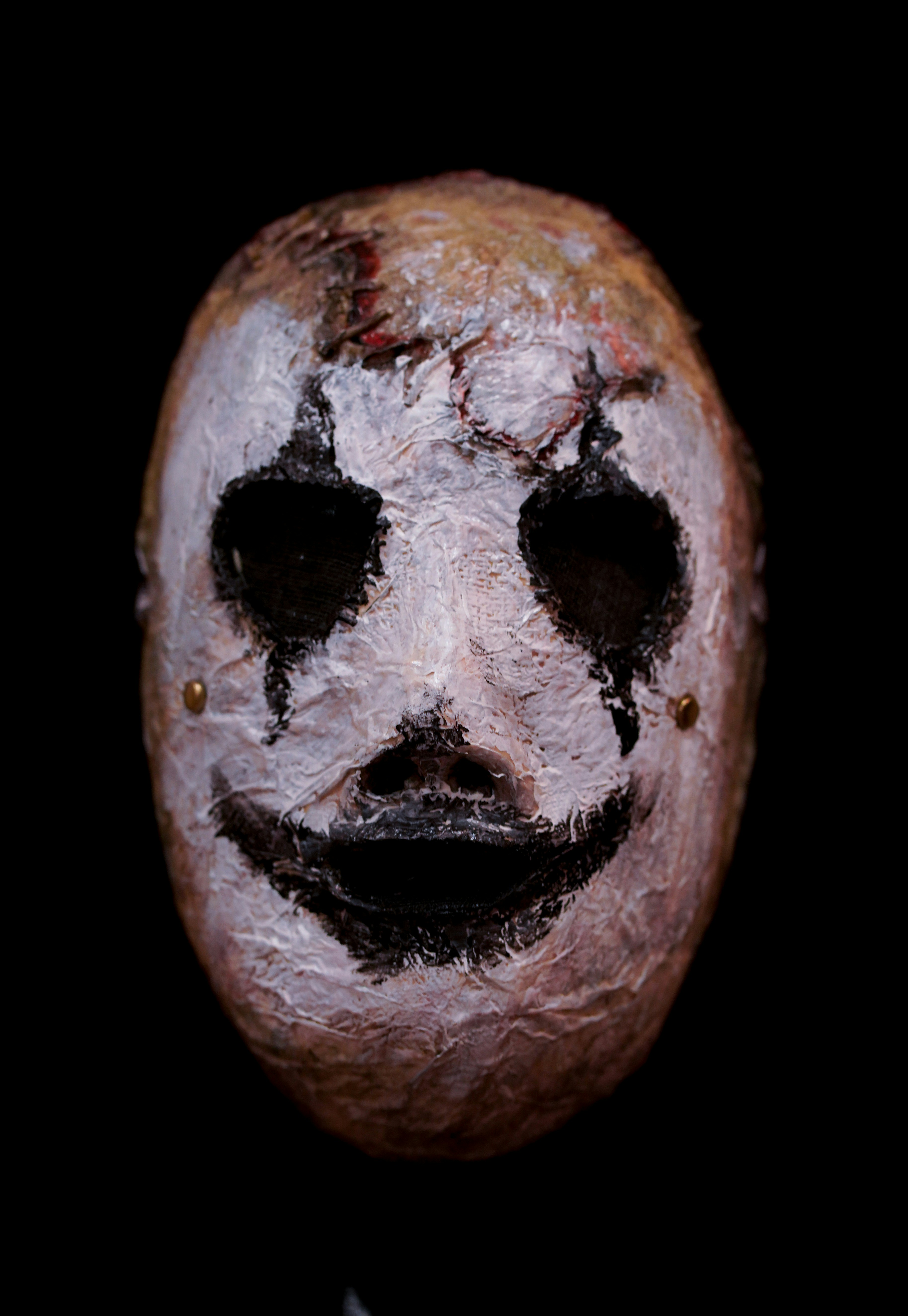 A creepy looking face painted on a piece of bread photo – Free Creepy ...