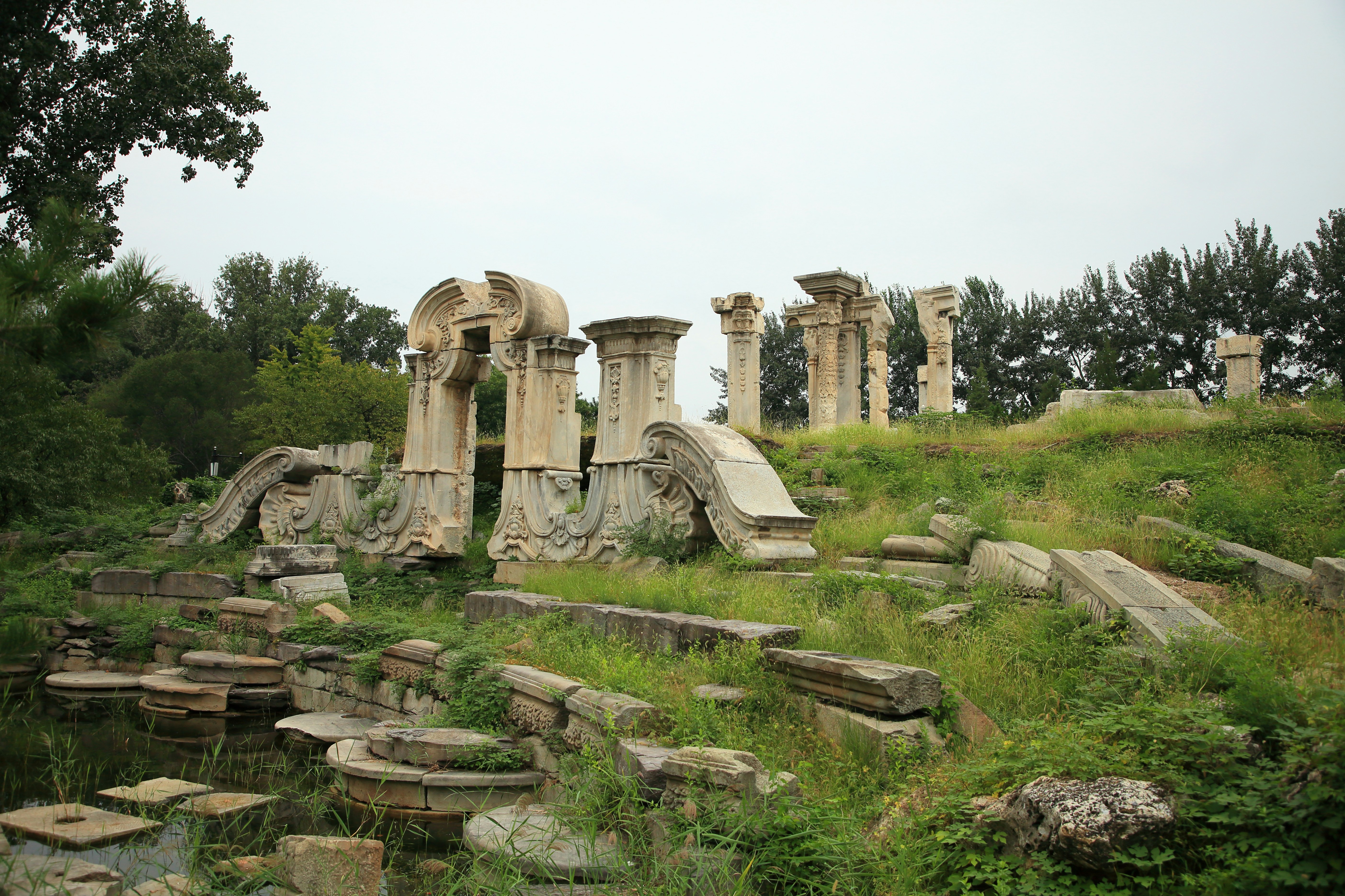 Verdant Ruins: Stone Arches Reclaimed by Grass