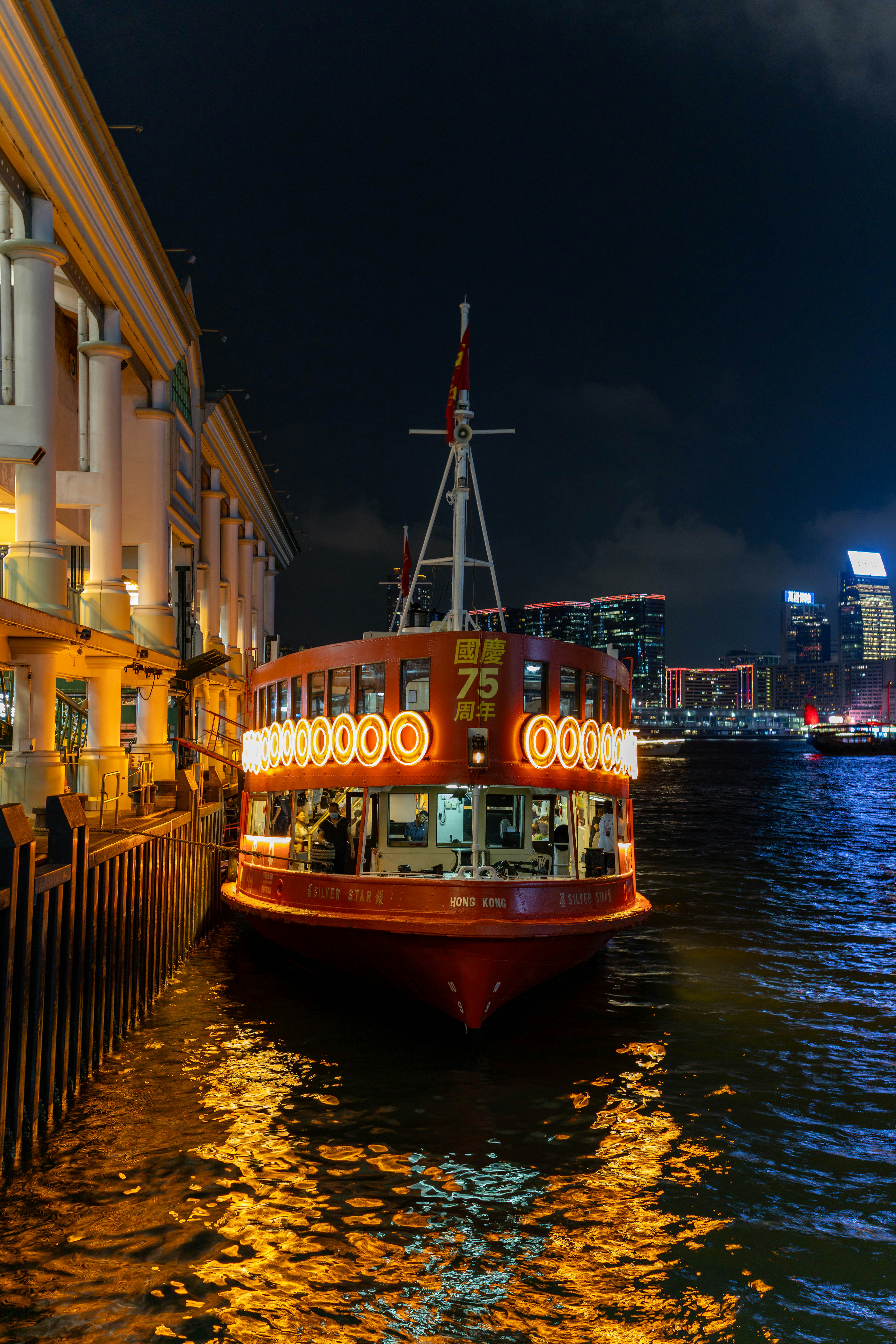 Neon Rings on the Star Ferry: Night Reflections Over Victoria Harbour