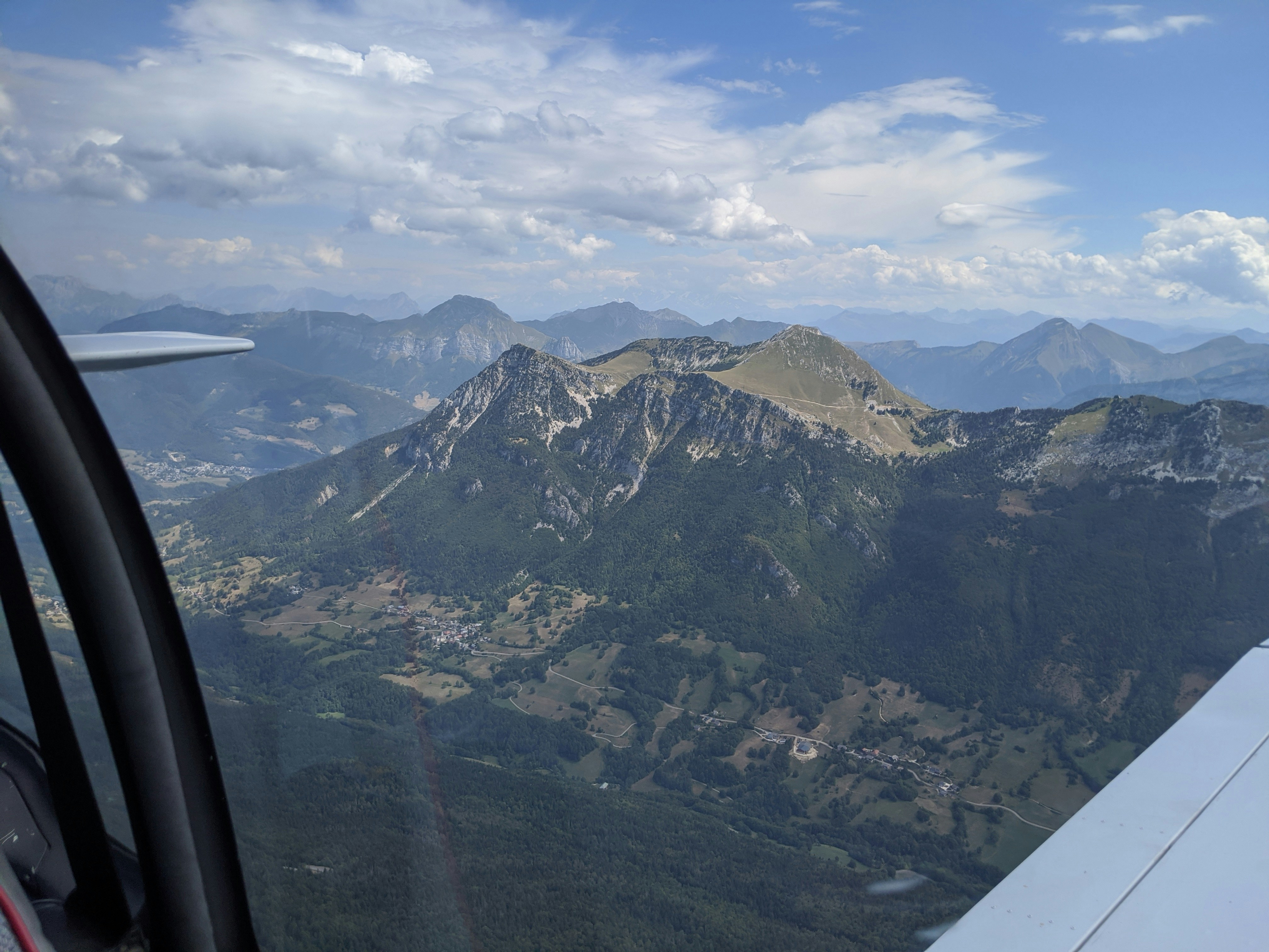 Ridgeline Panorama: Alpine Peaks Unfold Beneath a Window Seat
