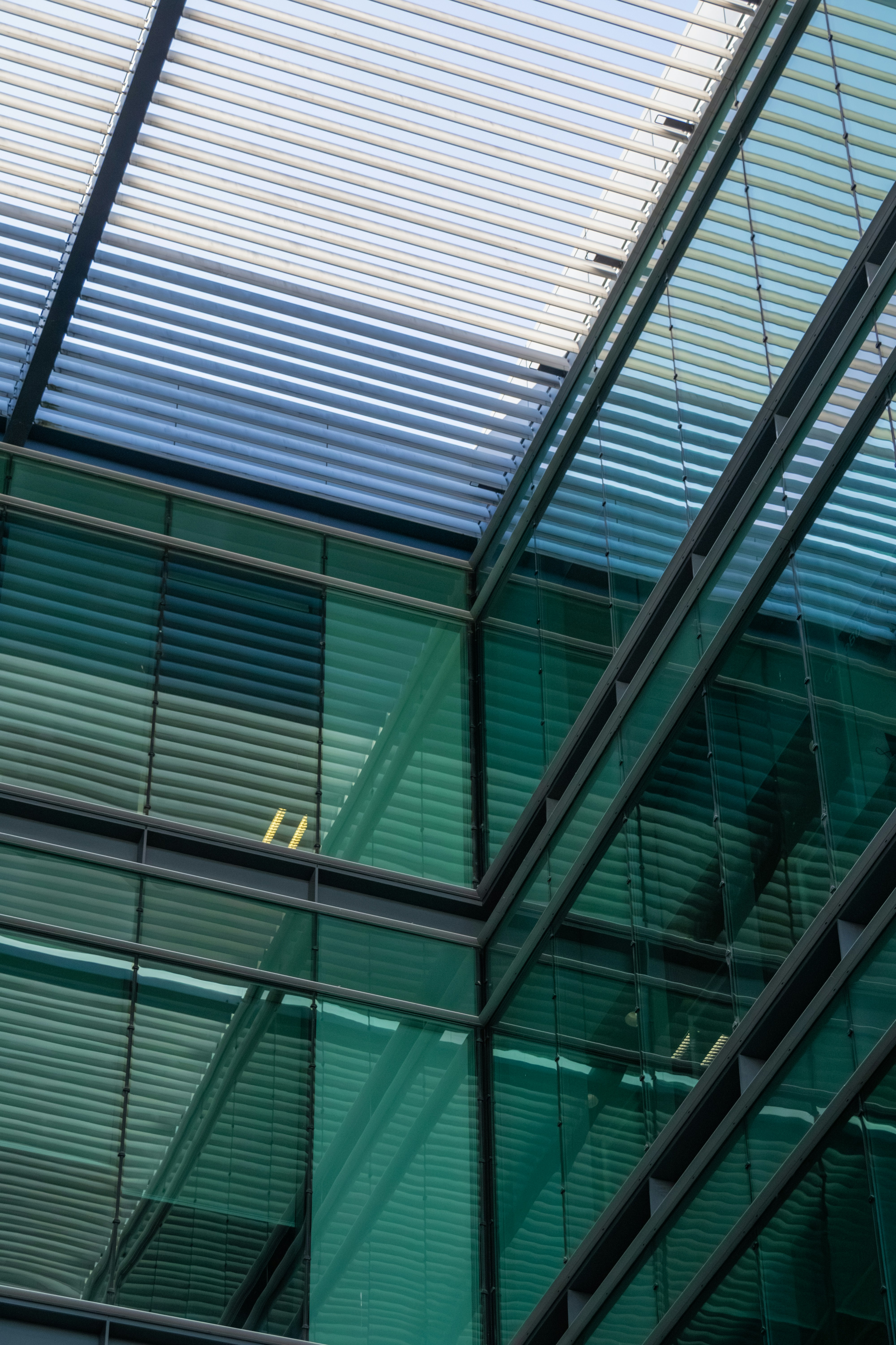 Prismatic Angles: Multicolored Glass Facade in Sharp Lines