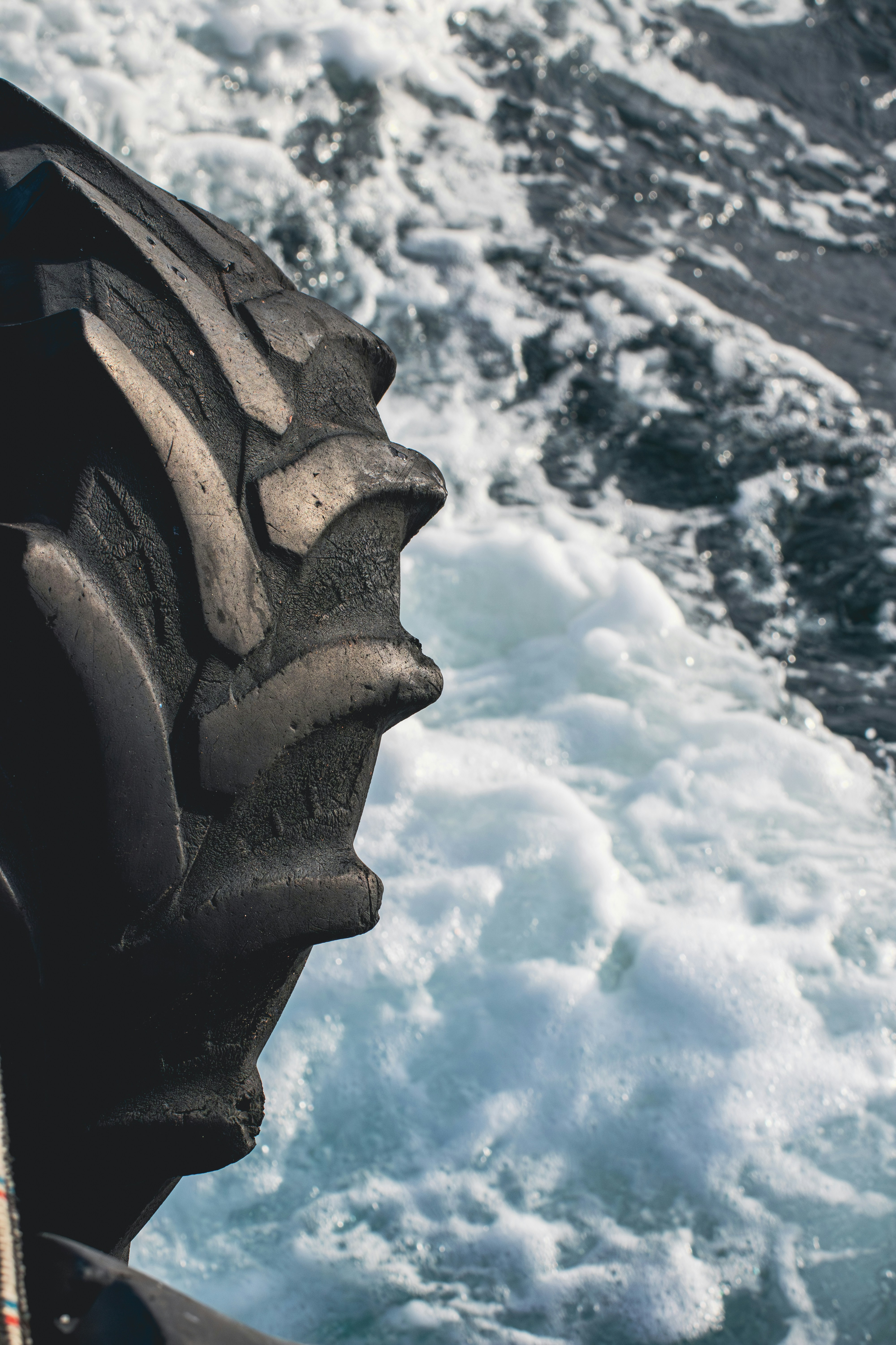 Industrial Tread: Snowfoam and Metal Weave from a Snow-Covered Gear