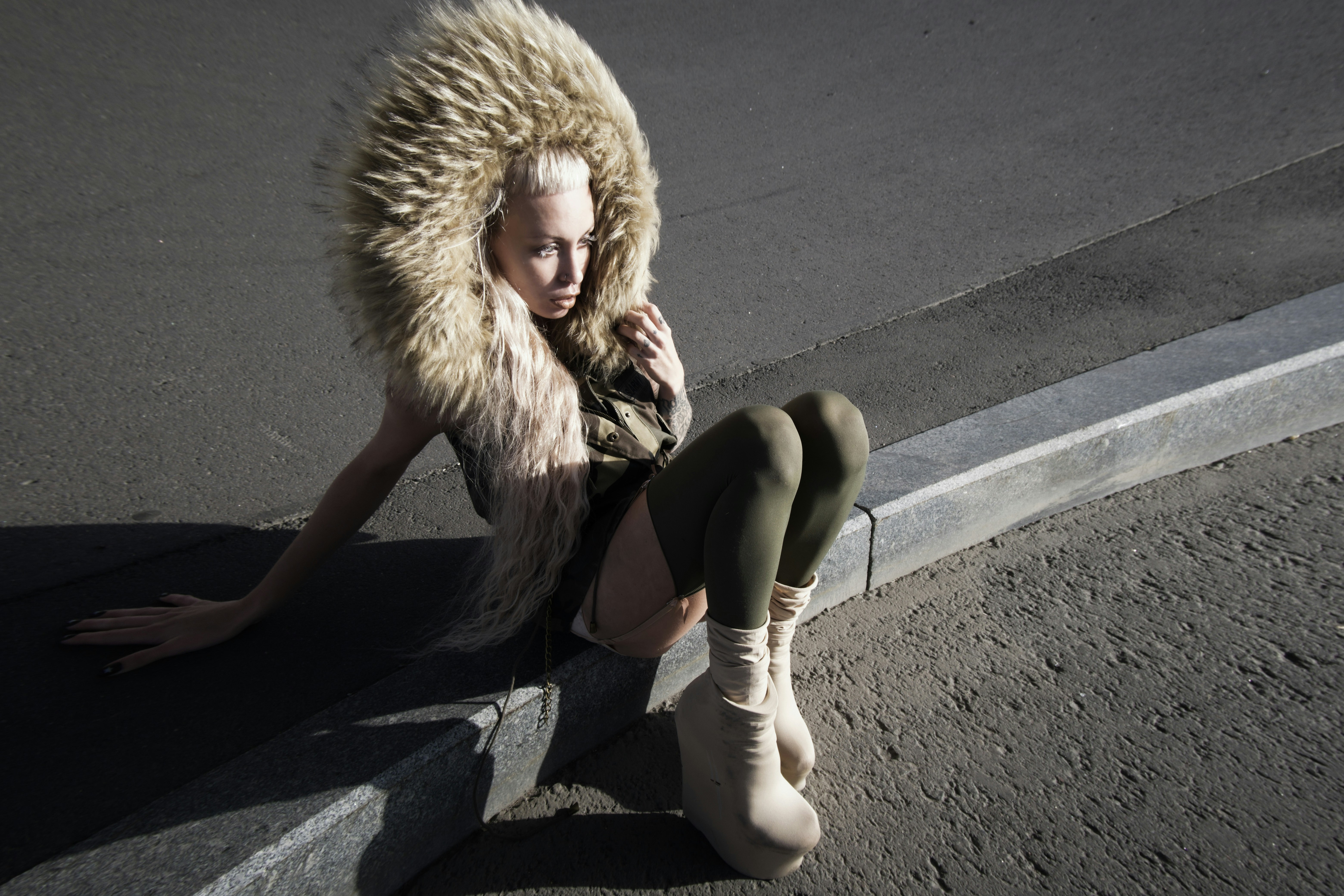 Concrete Catwalk: Velvet Hooded Gaze on the Edge