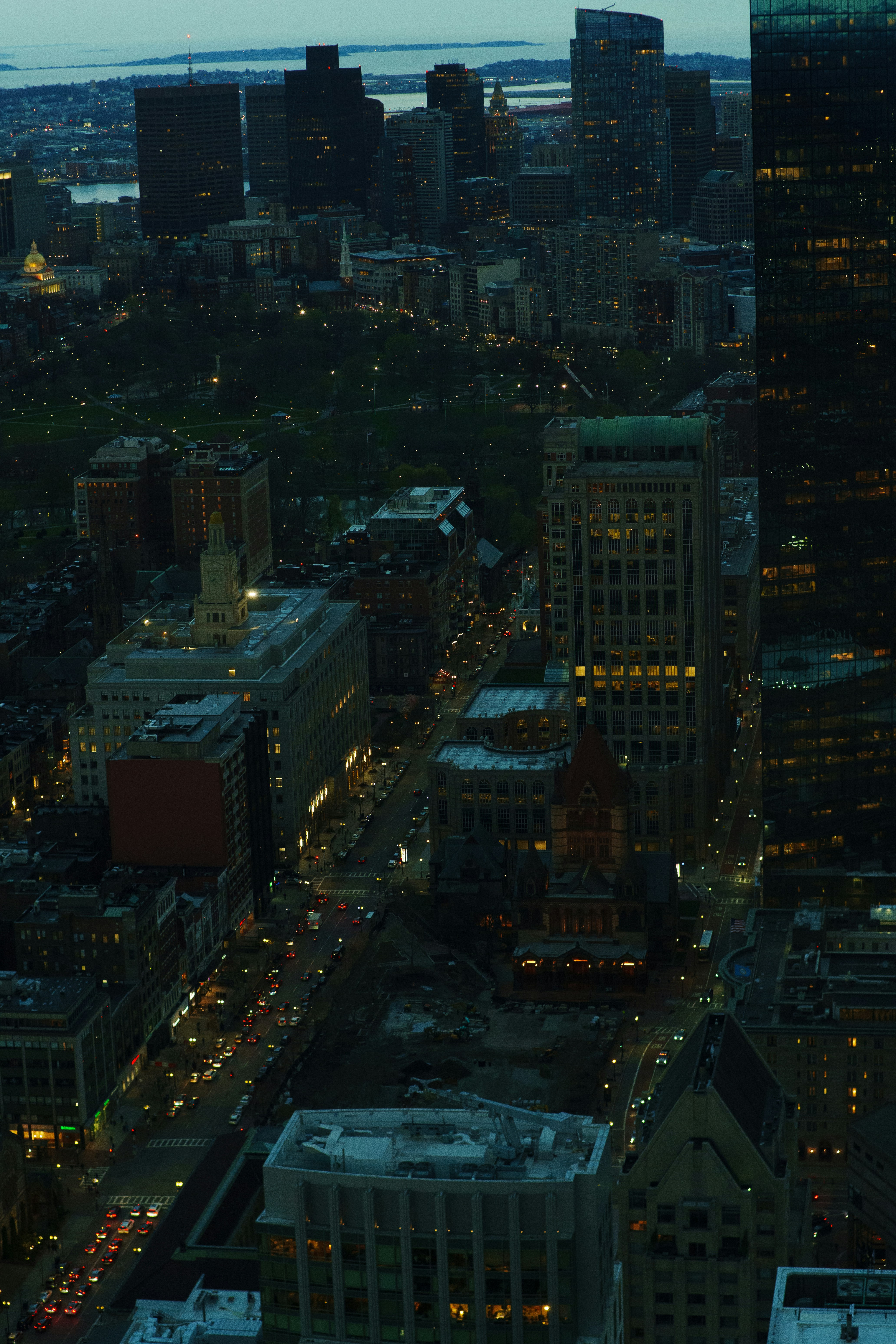 A view of a city at night from the top of a building photo – Free ...
