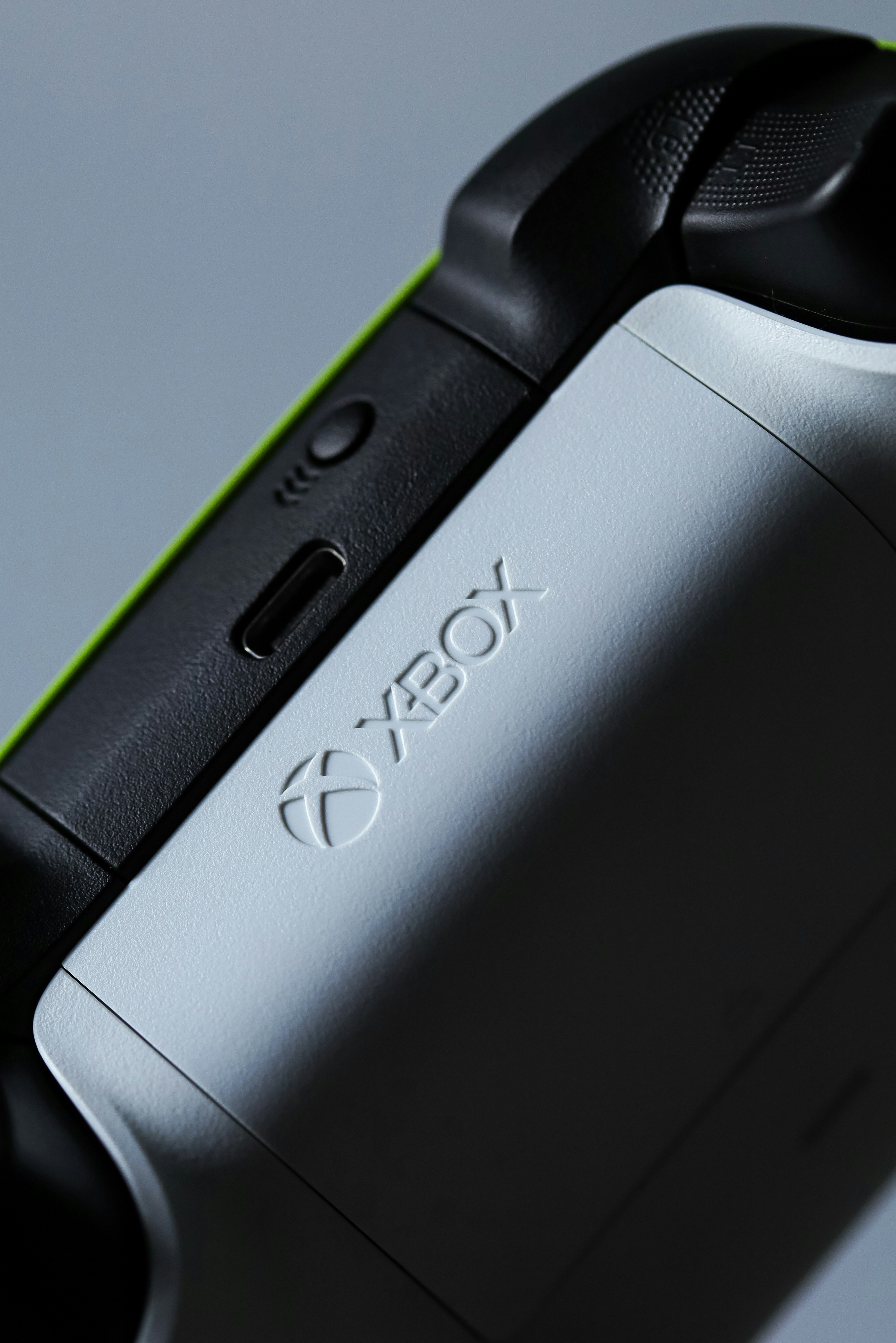 Lime-Trim Lexicon: A Close-Up of Xbox Emblem on a Matte White Shell