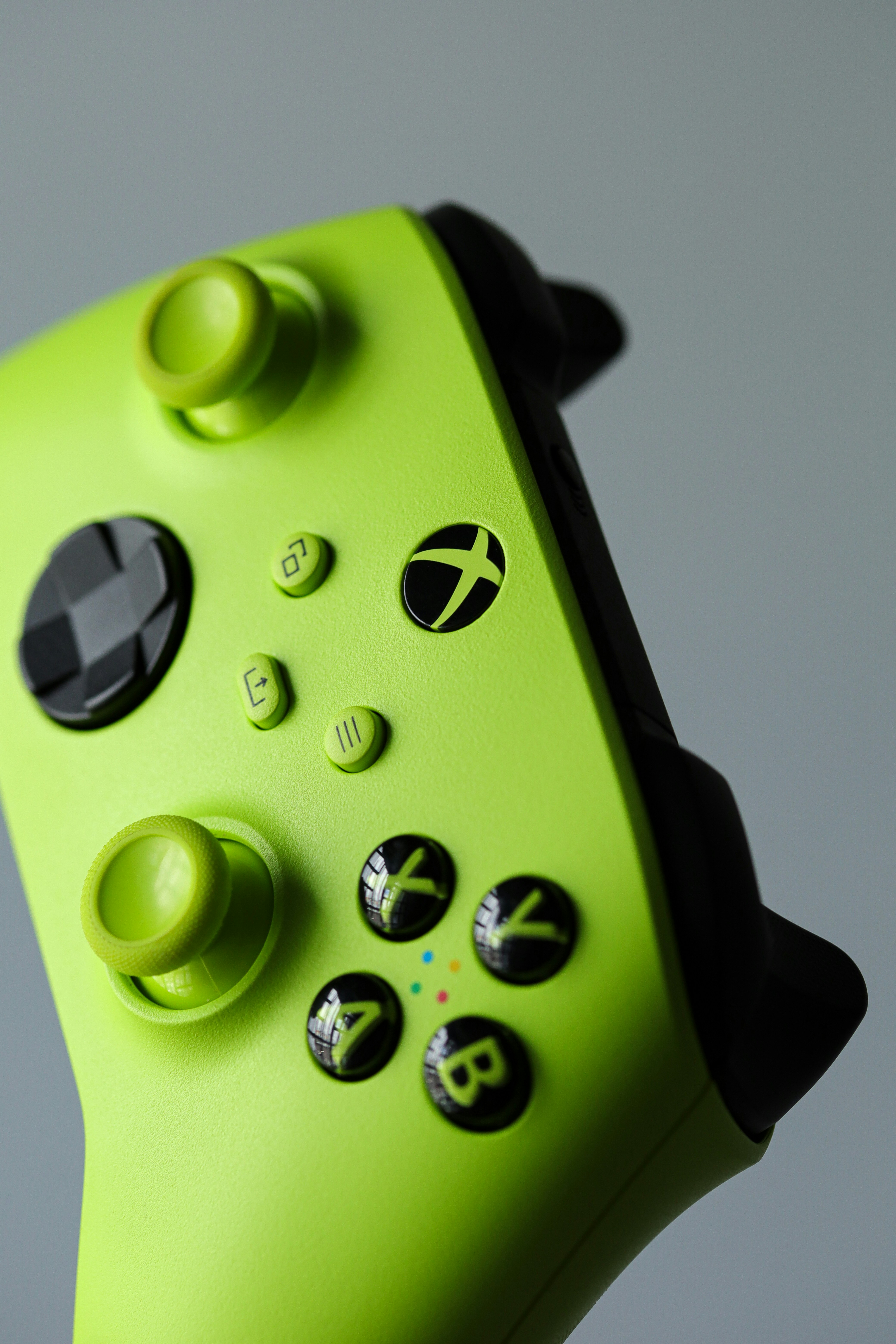 A close up of a green video game controller photo – Free Tech ...