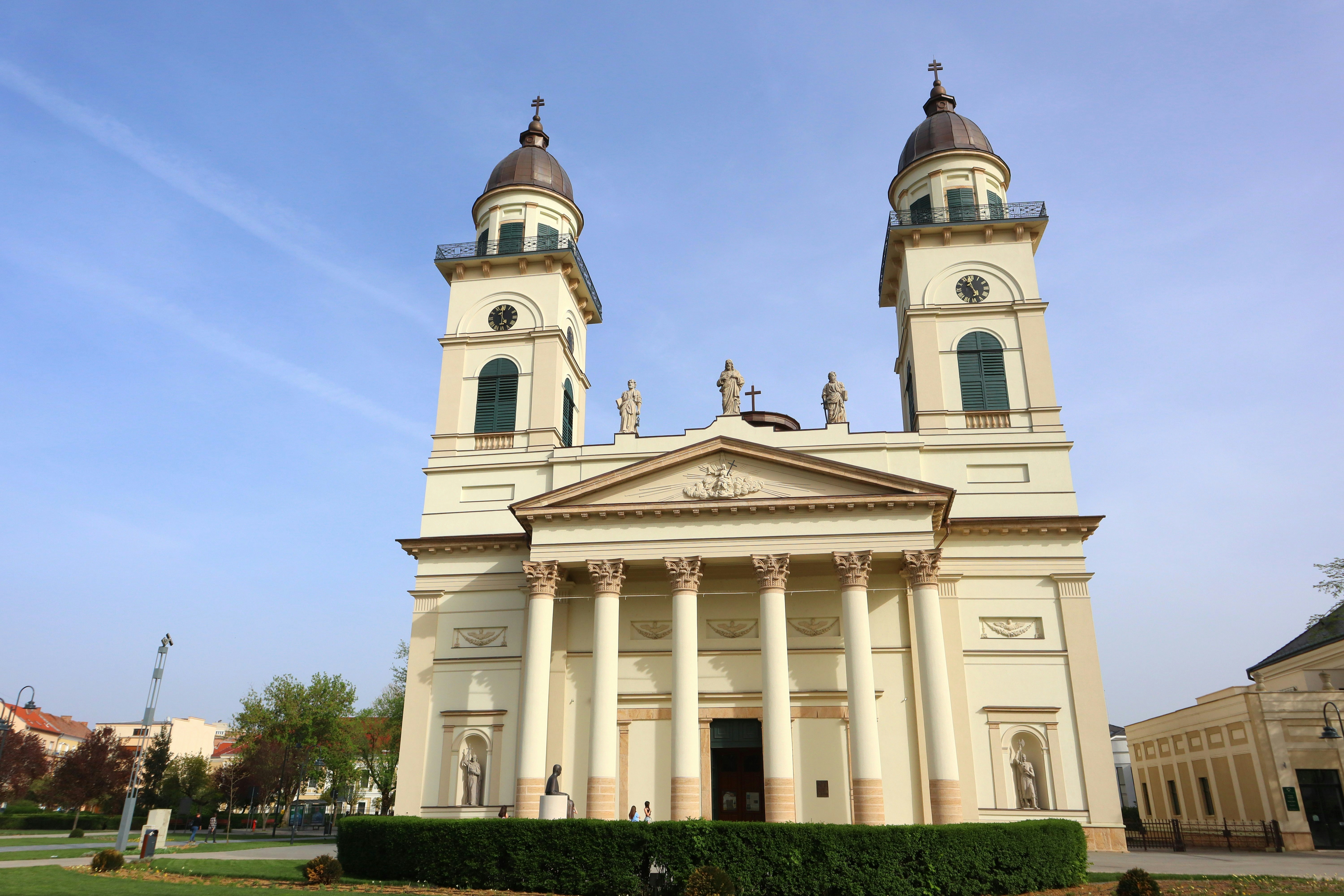A large white church with two towers on top of it photo – Free Romania ...