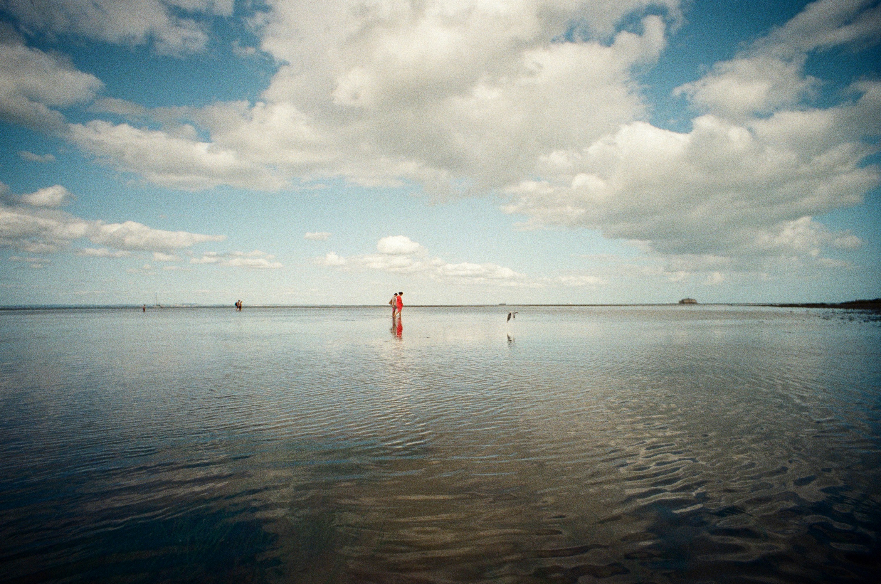 A body of water with clouds in the sky photo – Free Seaview Image on ...