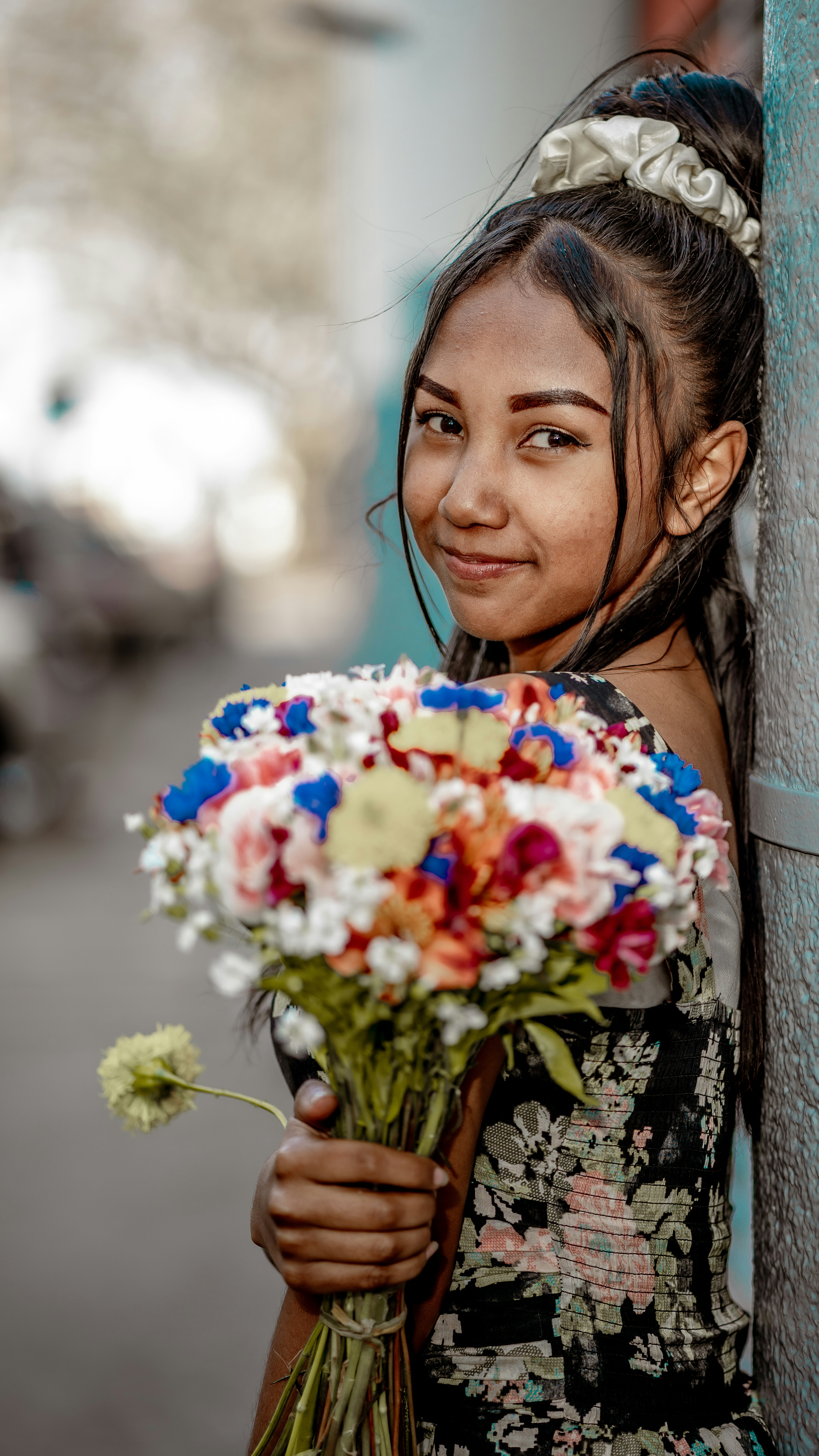Bouquet of Color: A Soft Smile by the Alley Wall