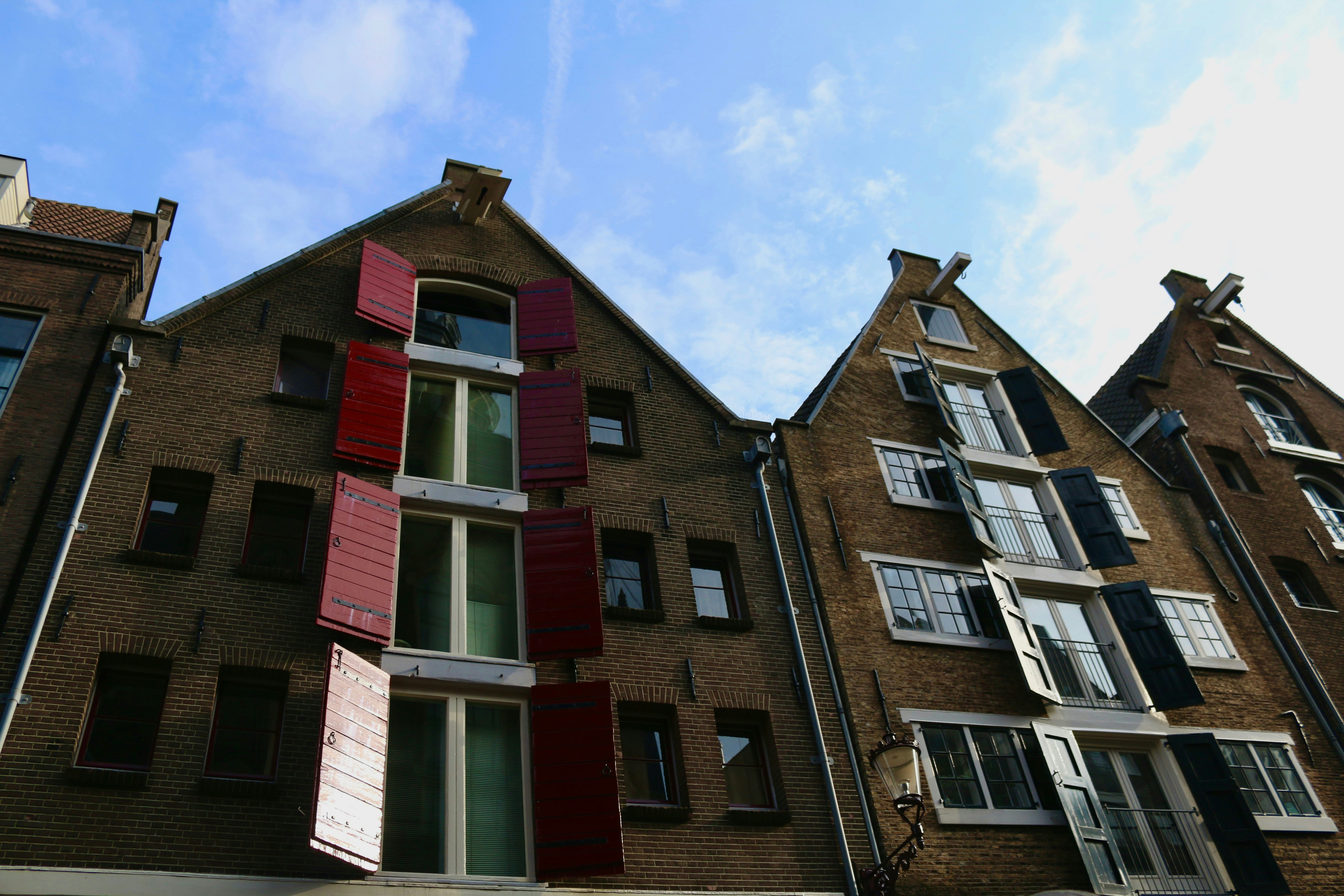 A row of tall buildings with windows and balconies