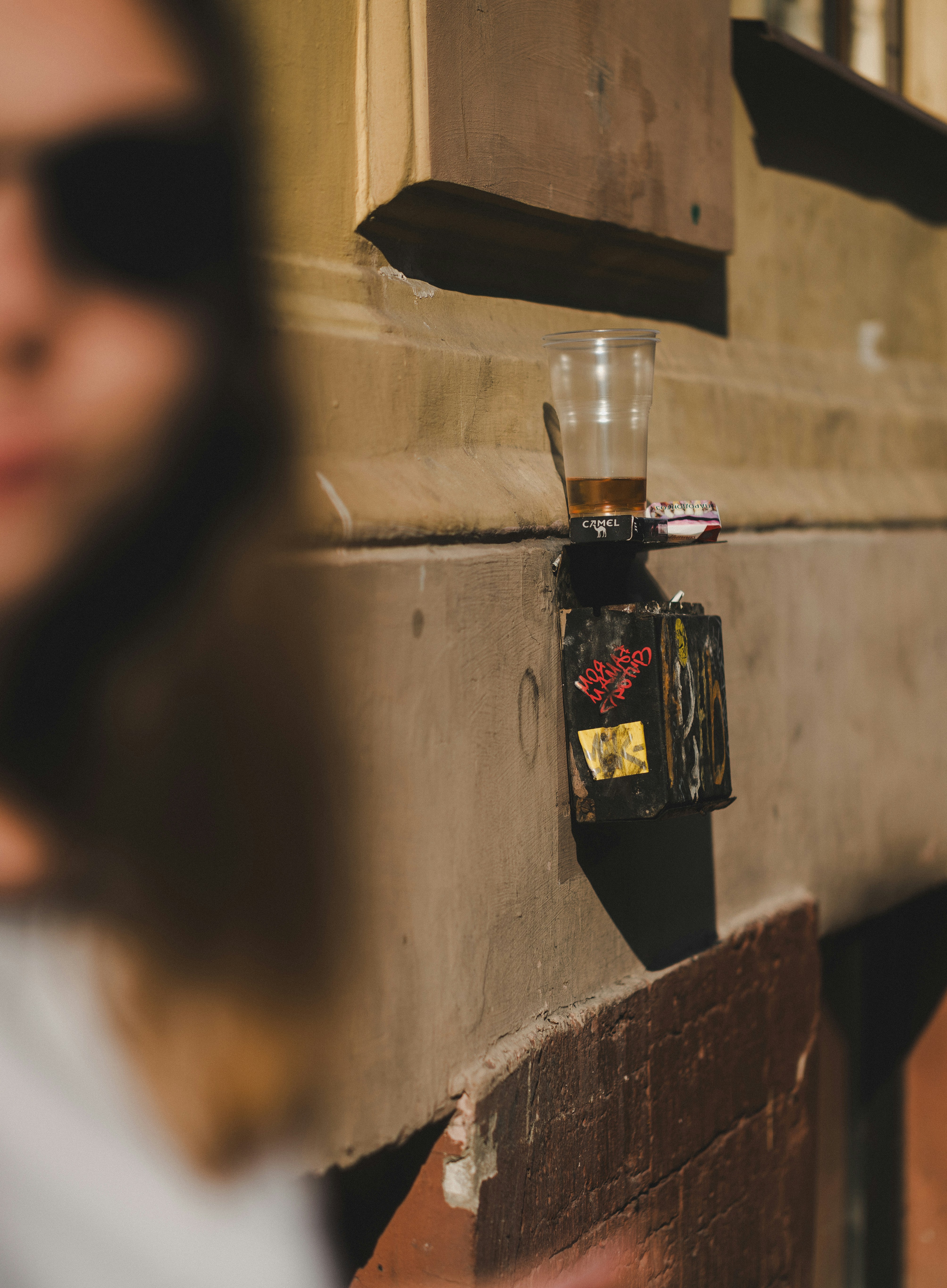 Partial Stranger, Full Frame: A Solitary Ablution on a City Wall