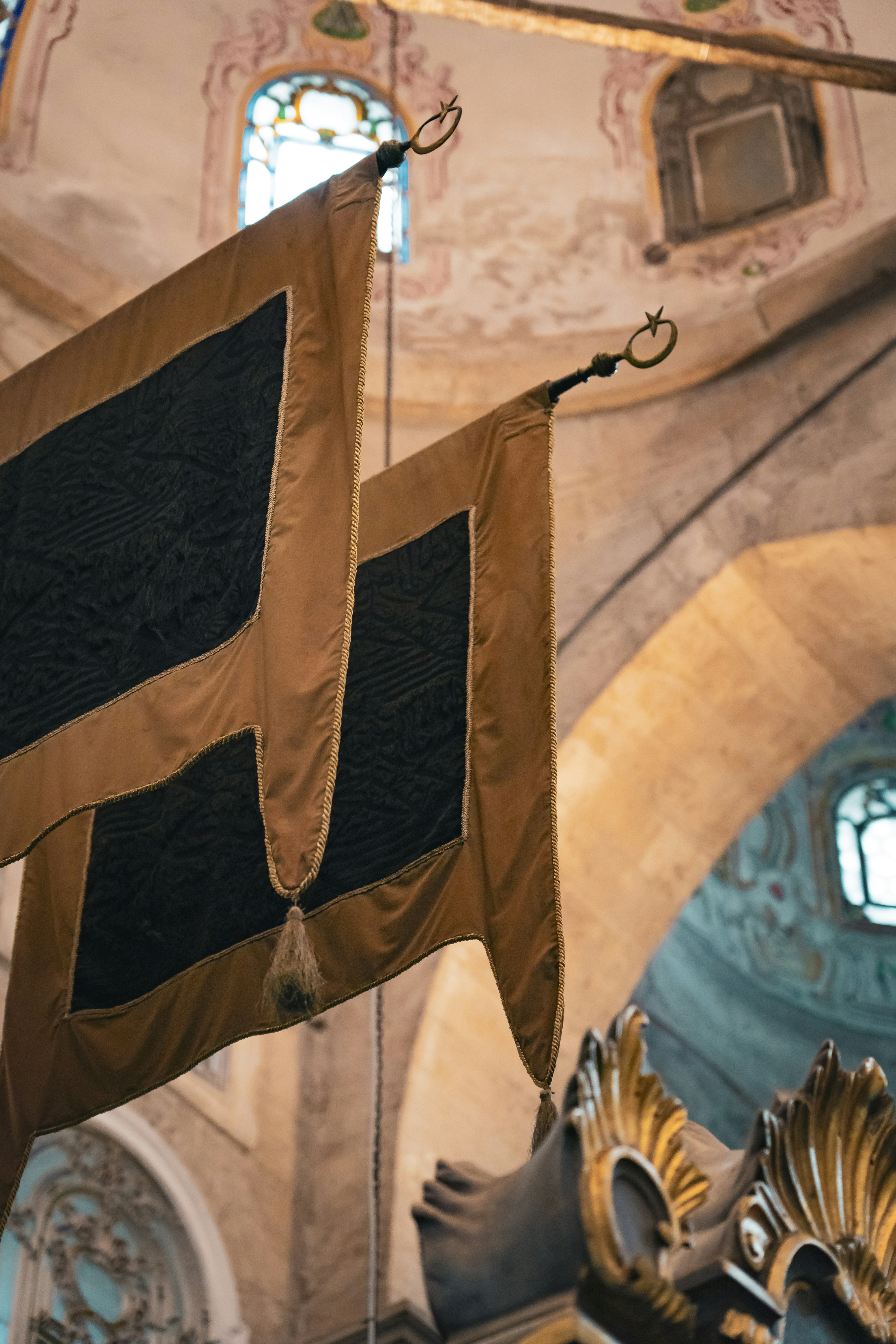 Velvet Banners in a Sunlit Nave: Quiet Ceremony Under Painted Arches