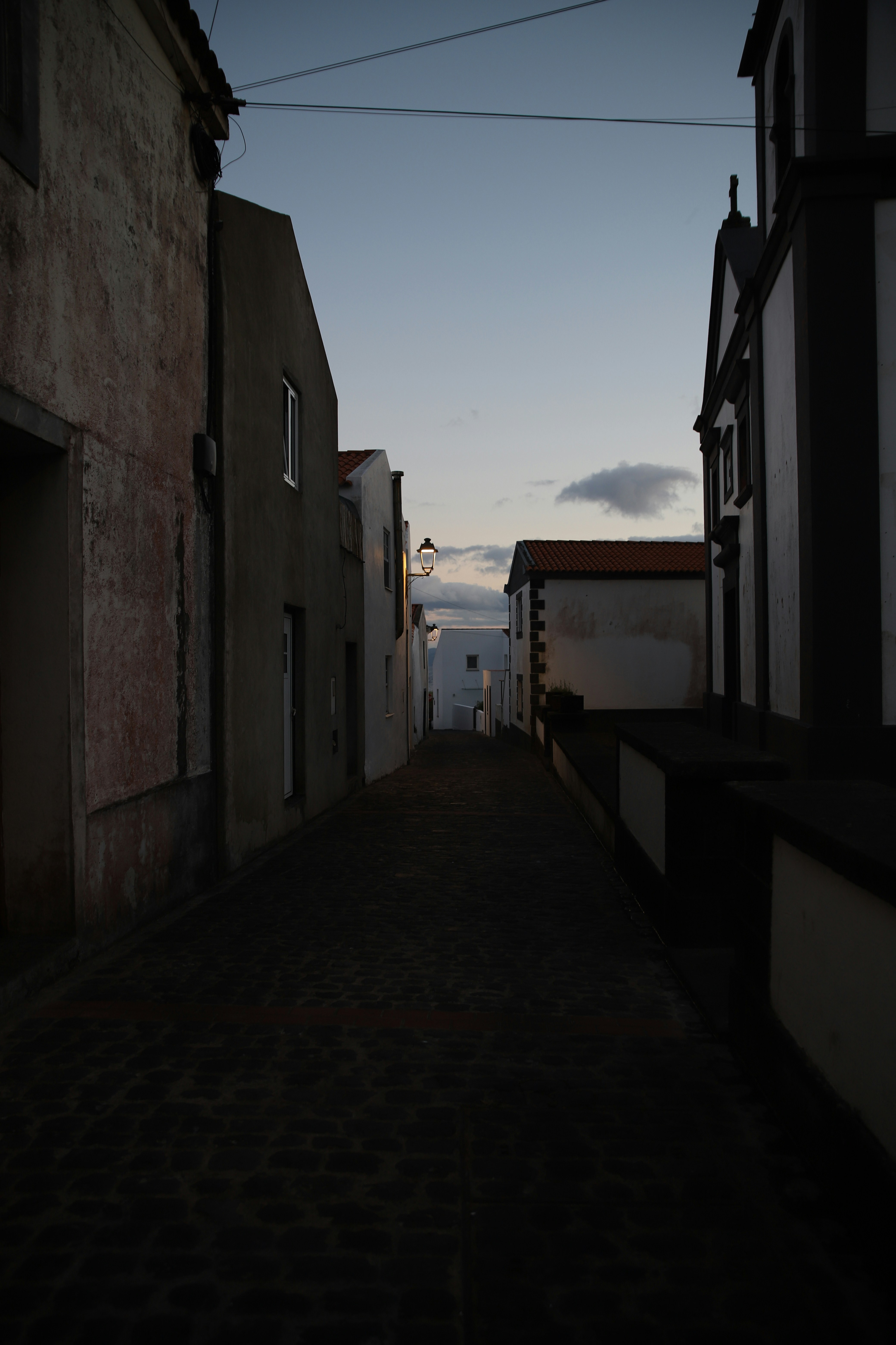 Dusk Along a Cobblestone Calle: A Narrow Alley Reaching Toward the Distant Lantern