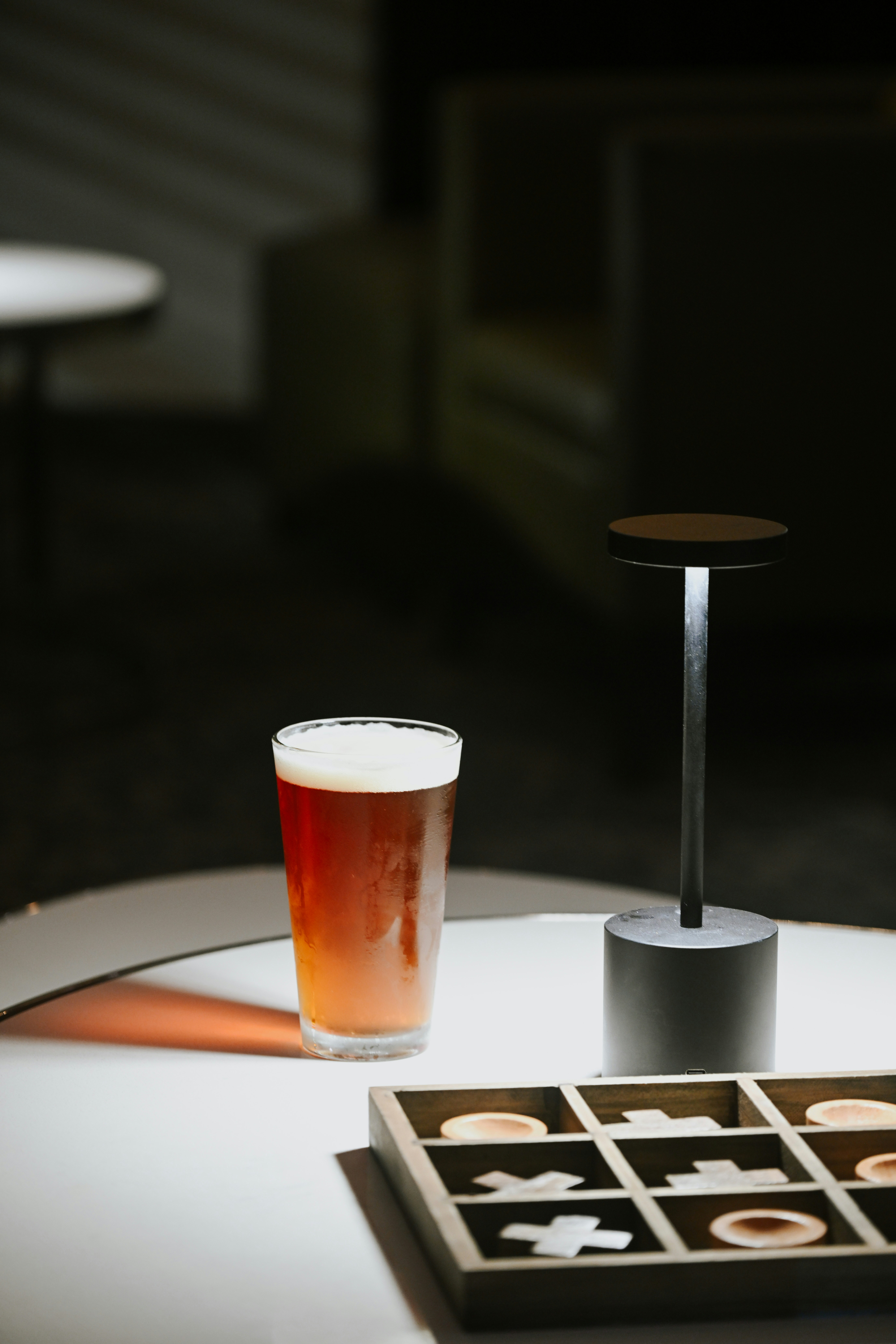 A glass of beer sitting on top of a table photo – Free Food and drink ...
