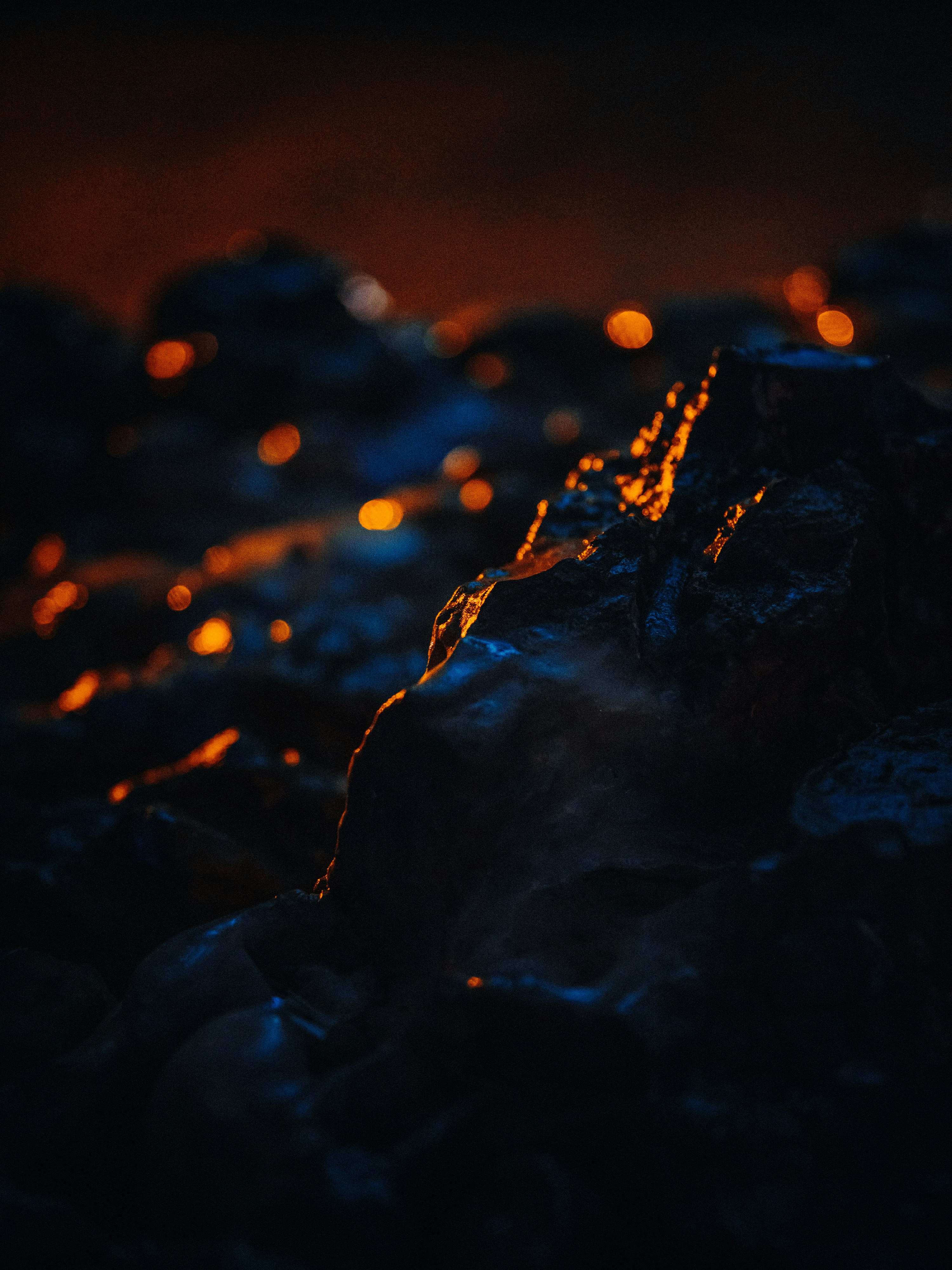 A blurry photo of rocks and water at night photo – Free Fire Image on ...