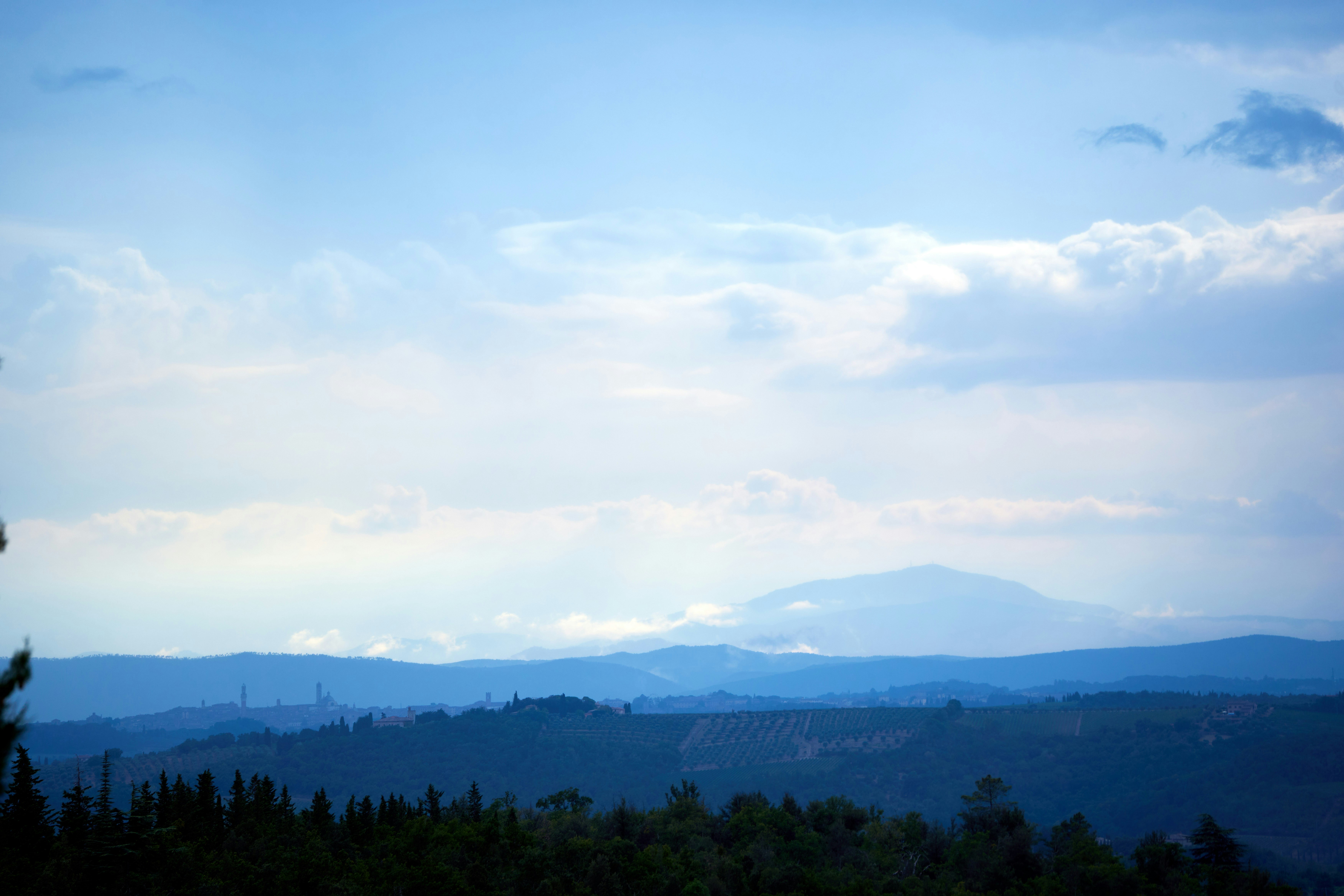 A view of a mountain range from a distance photo – Free Nature Image on ...