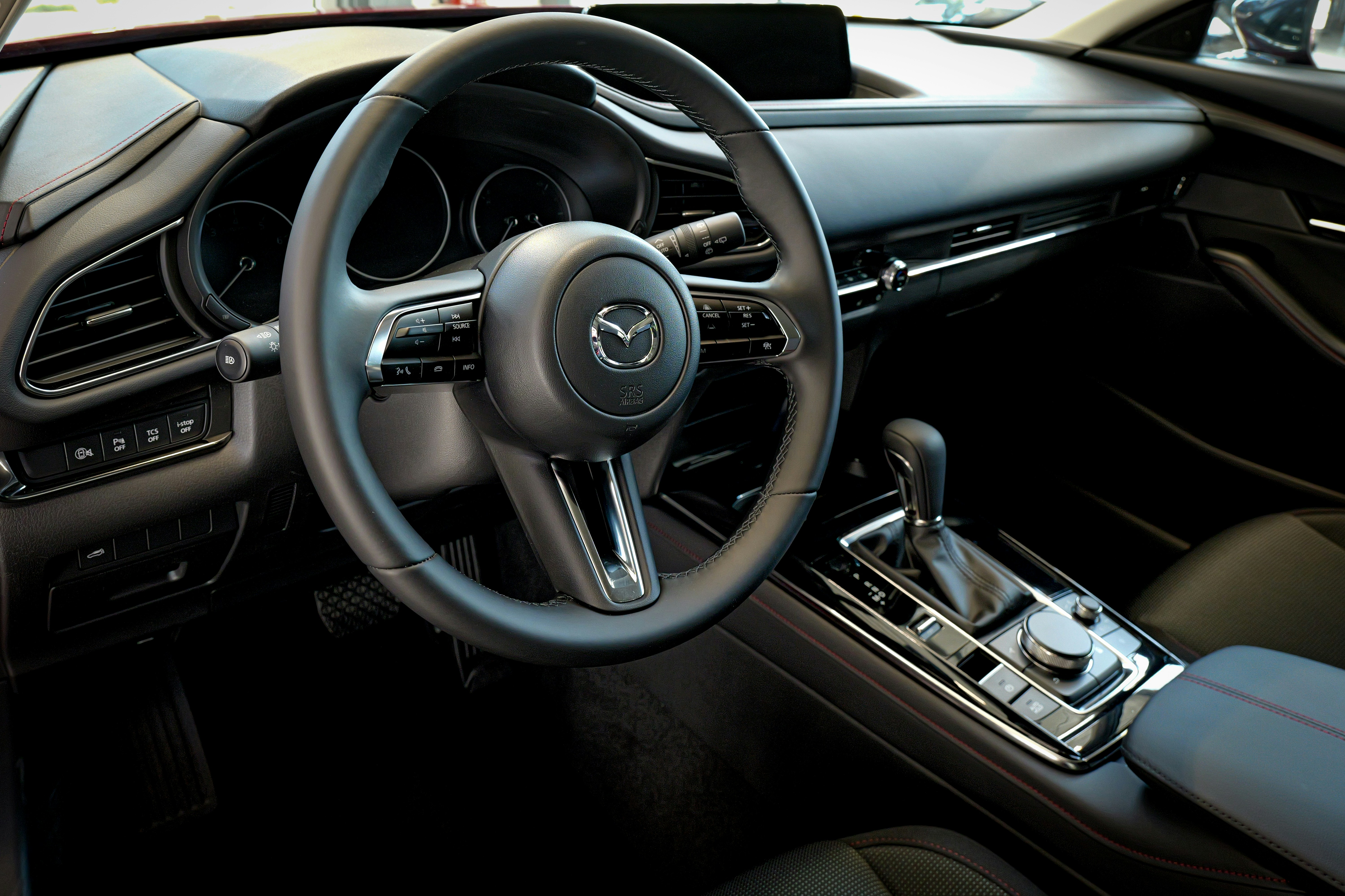 The interior of a car with a steering wheel and dashboard photo – Free ...