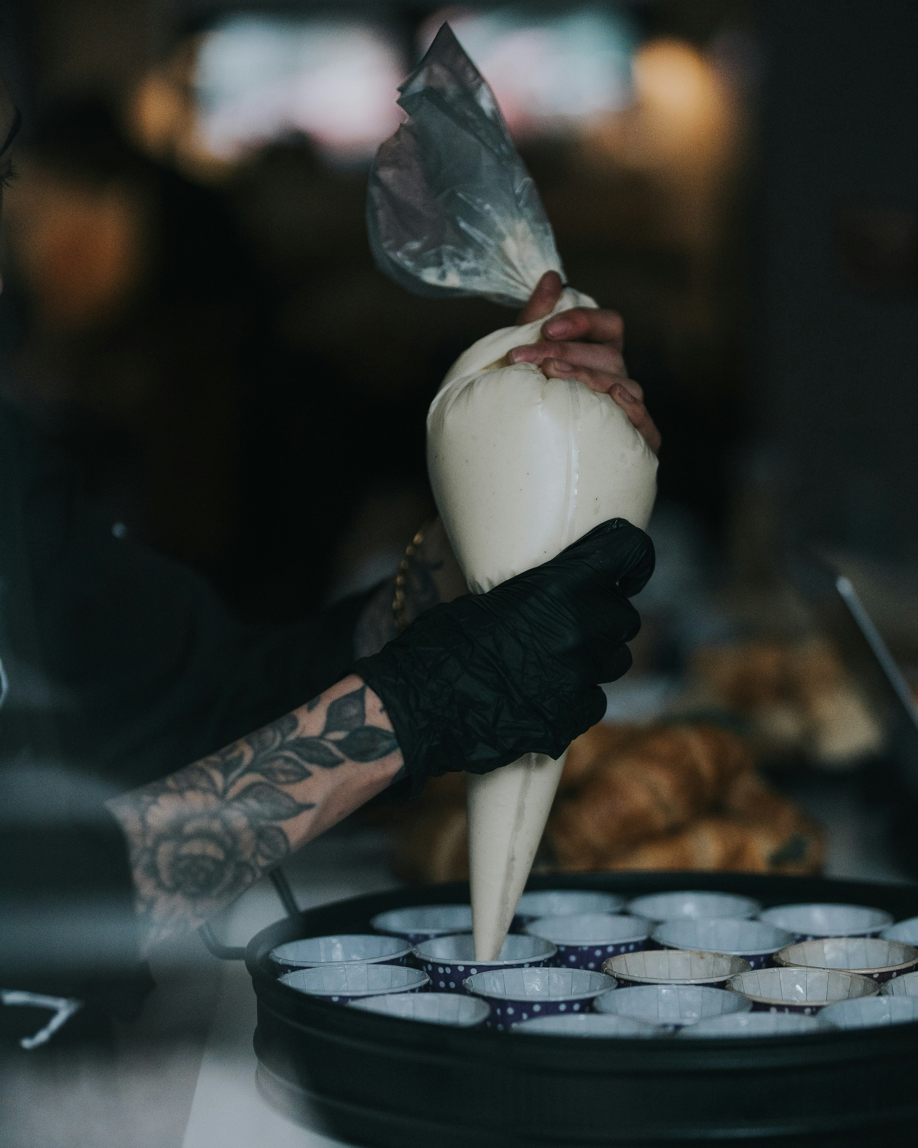 Precision Piping: Velvet Batter Flows into Petite Muffin Cups