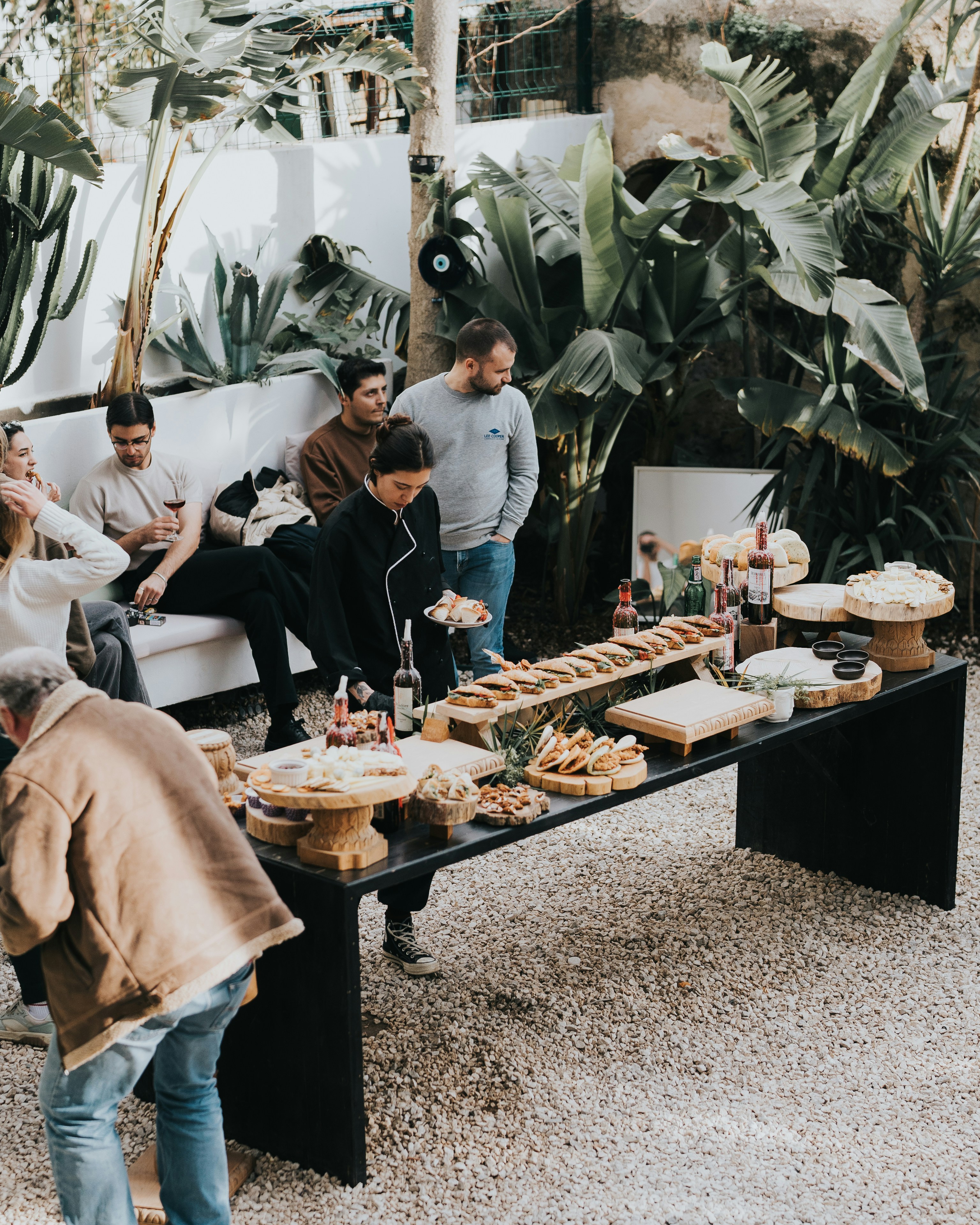 Garden Party Spread: A Casual Feast Along a Shaded Al Fresco Table