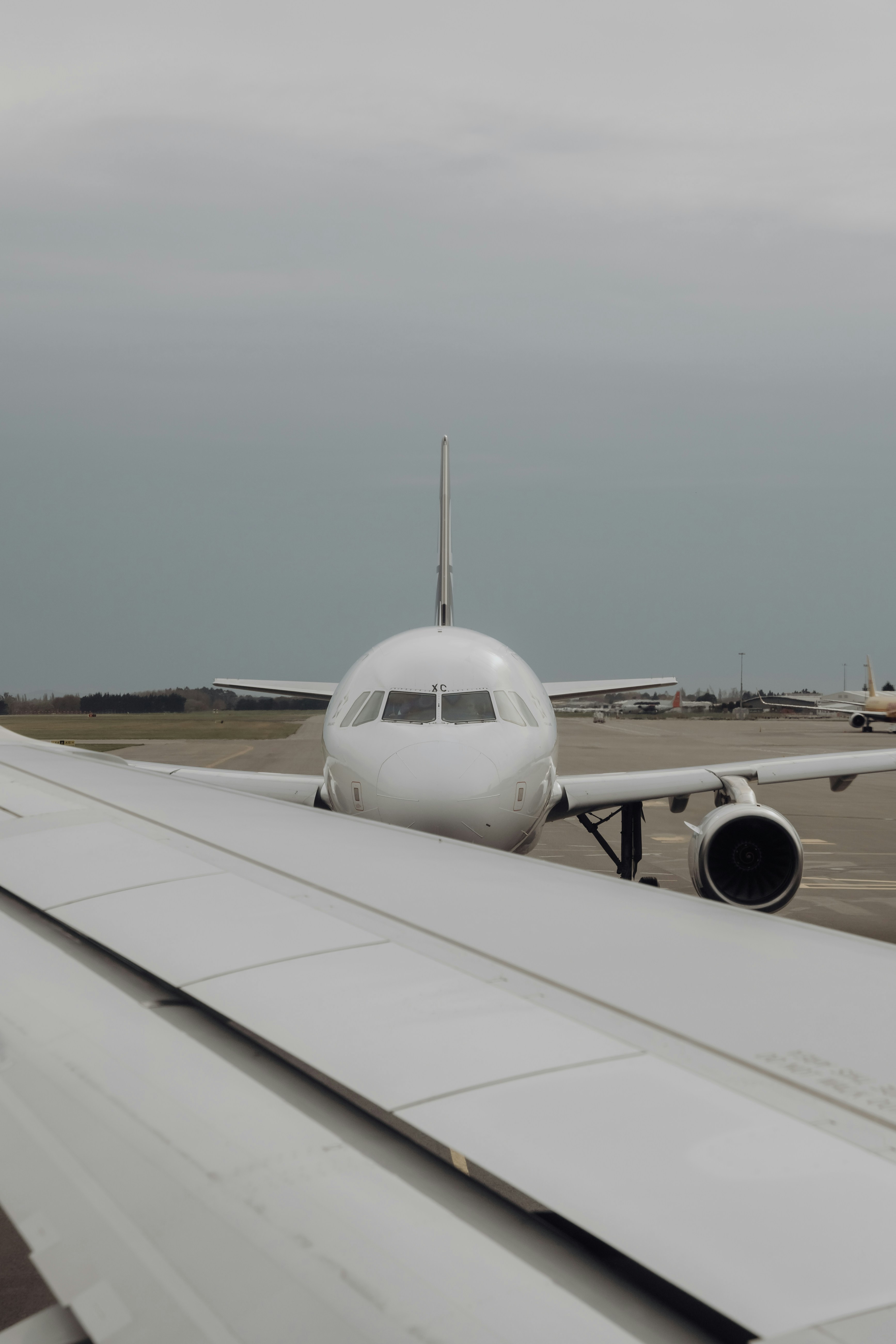 A large jetliner sitting on top of an airport tarmac