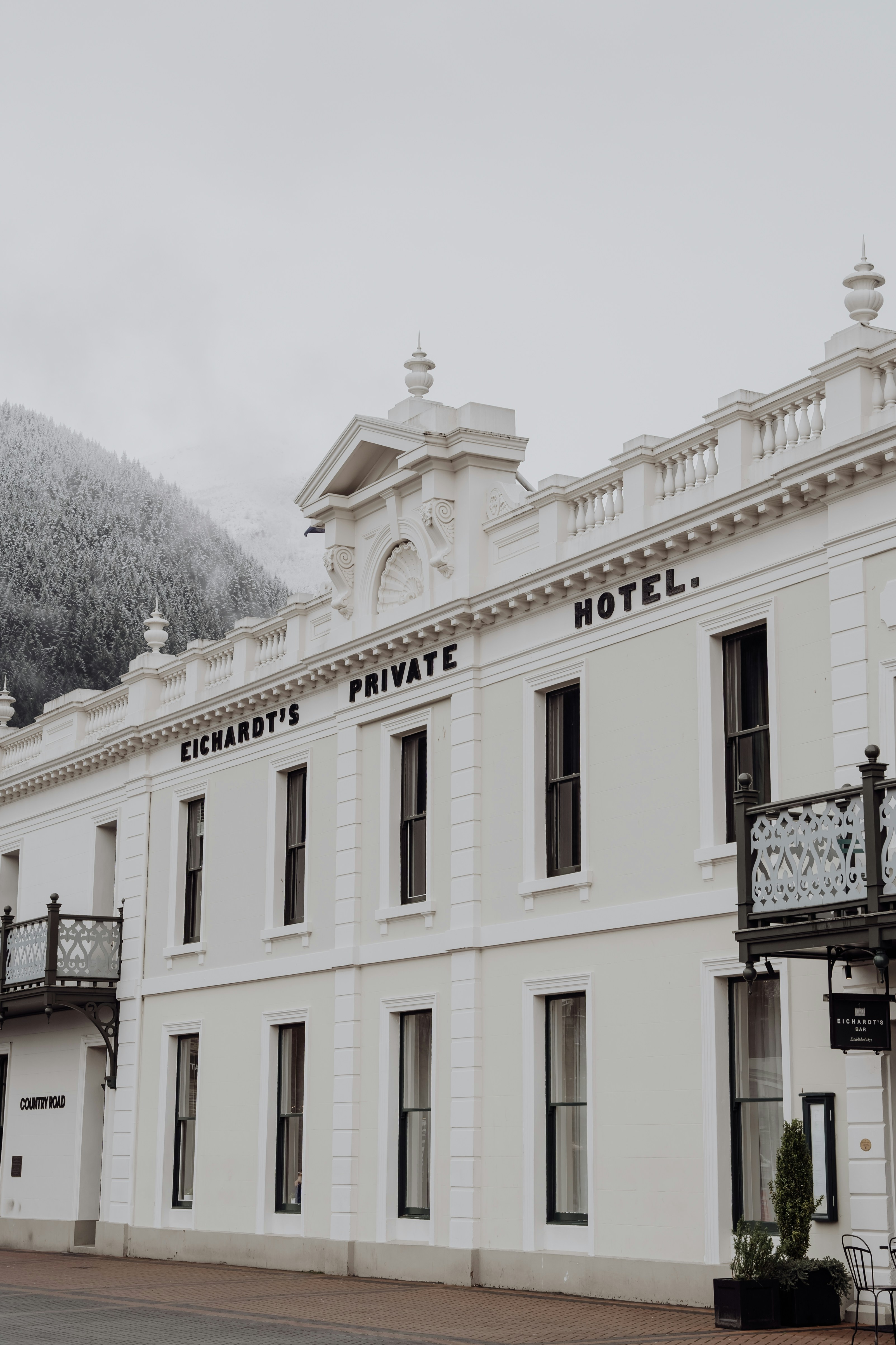 Snow-Framed Neoclassical Facade: Eichardt's Private Hotel on an Alpine Street
