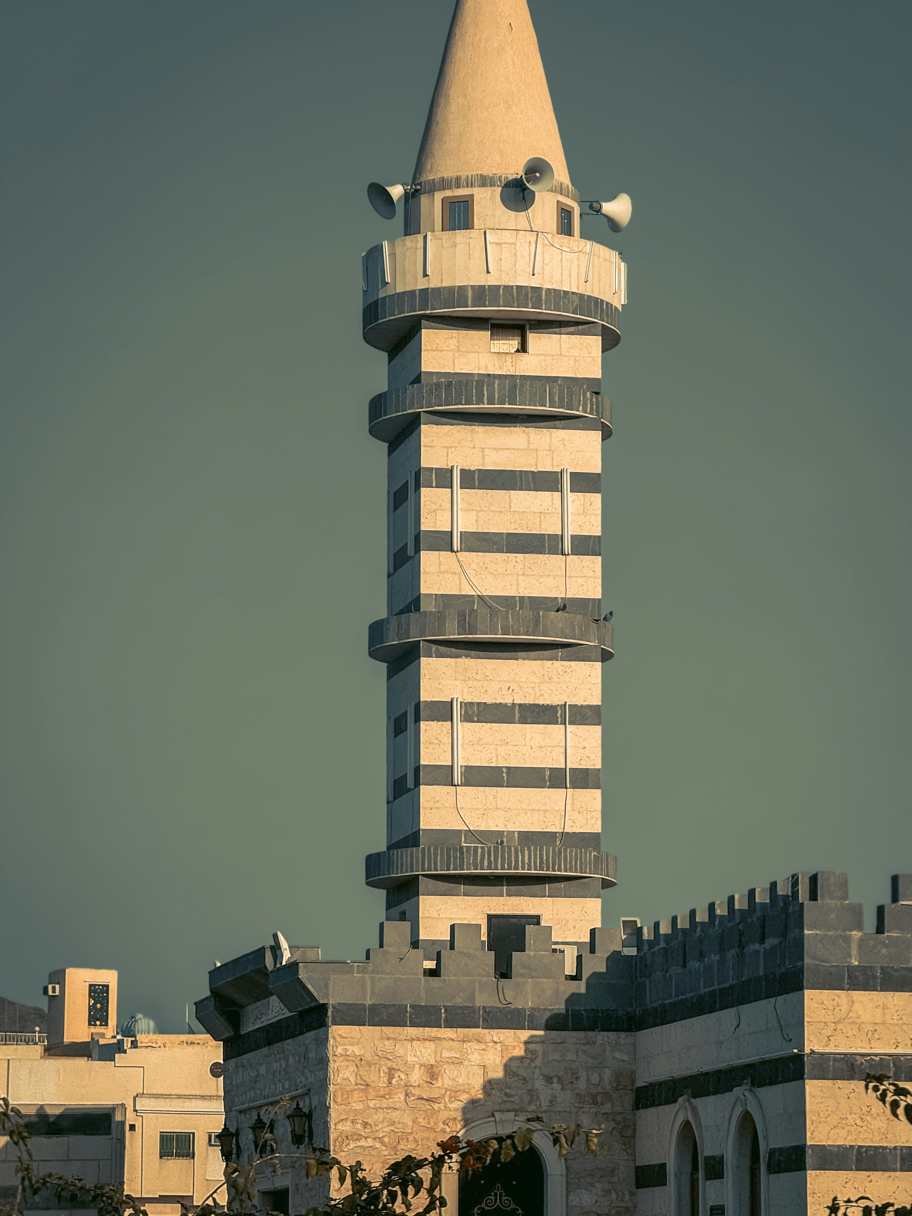 Cone-topped Sentinel Rising Over a Sunlit Fortress
