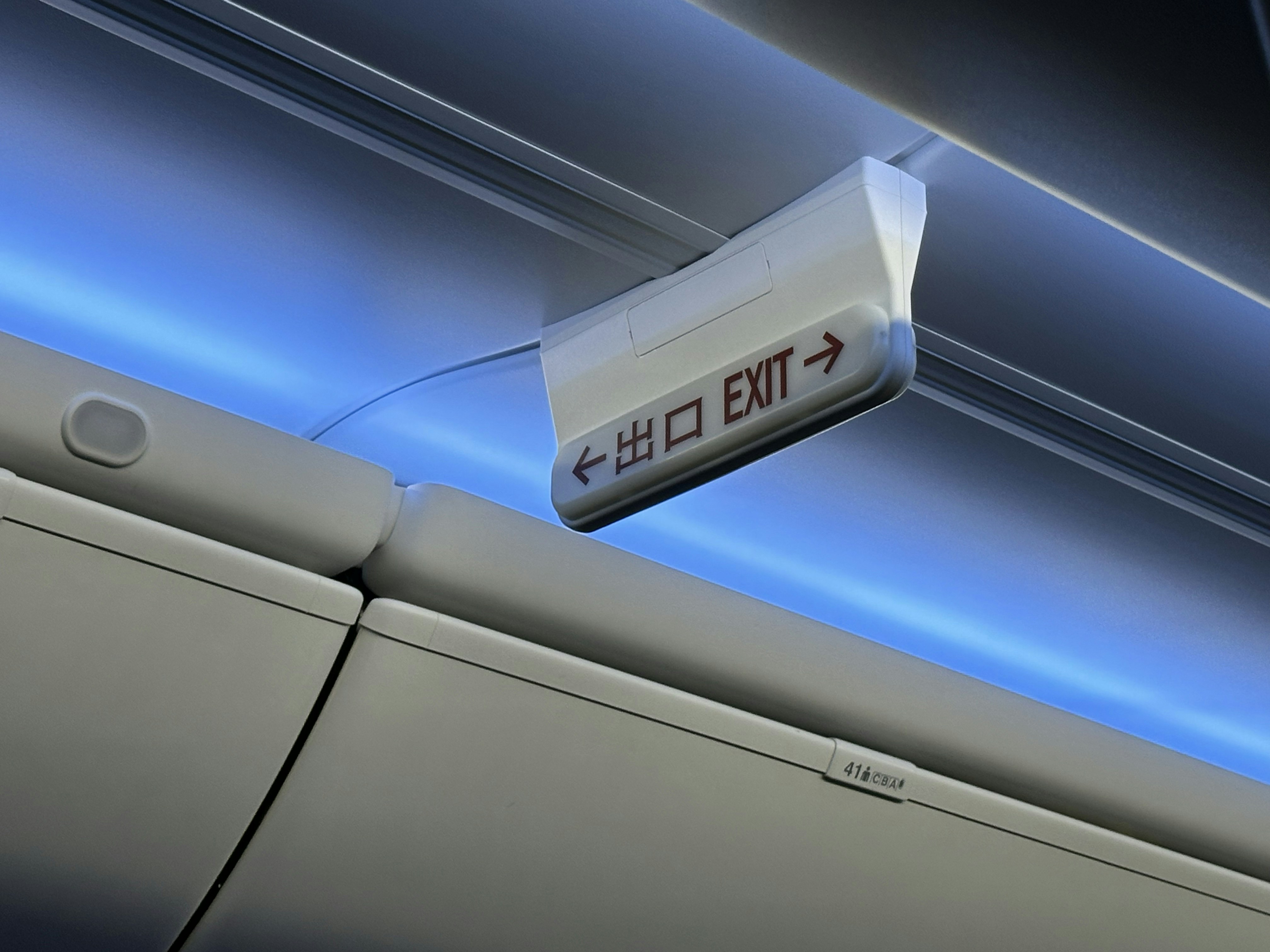 A close up of a sign on the ceiling of a plane photo – Free 飞机 Image on ...