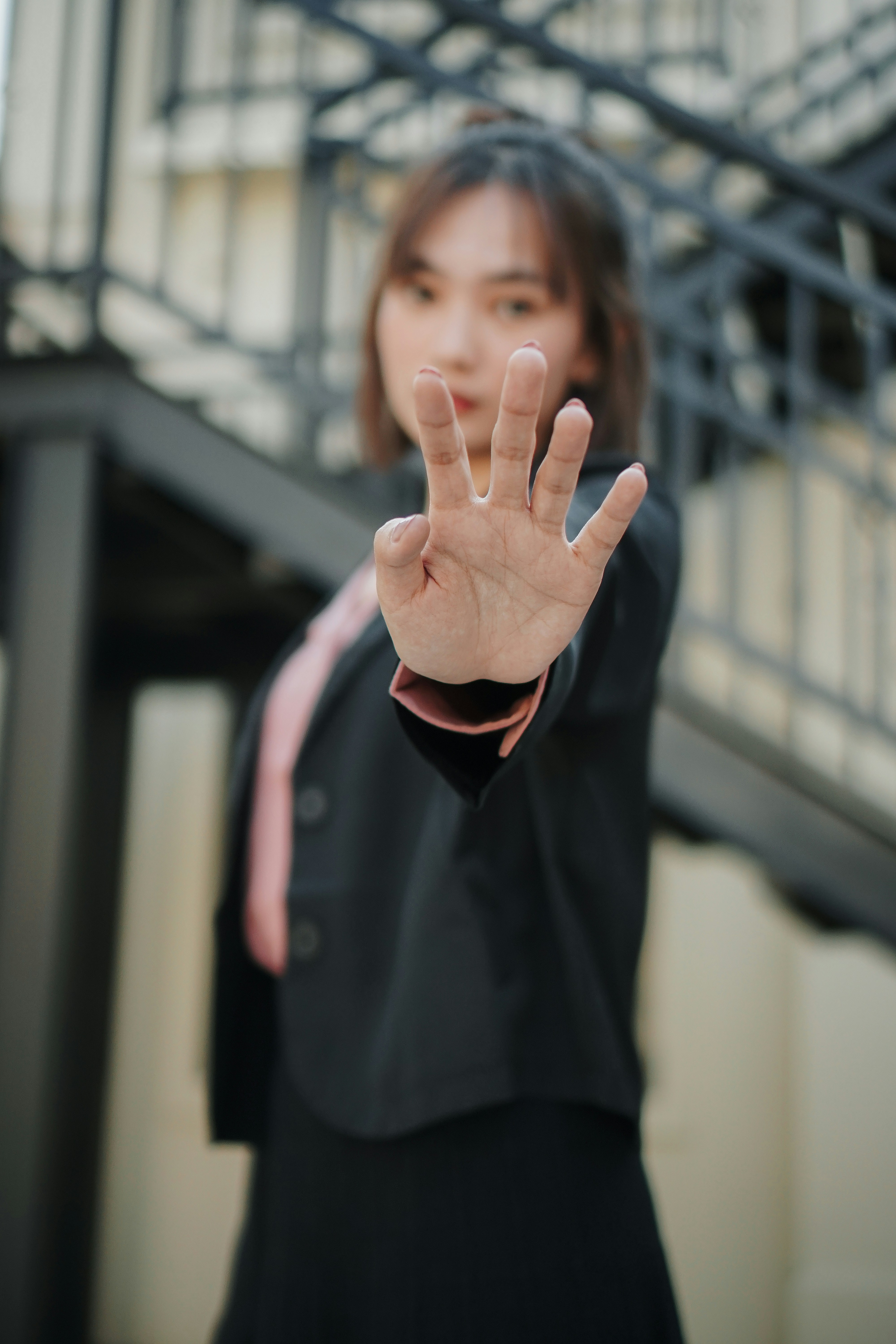 Forward Reach Against a Blurred Urban Staircase