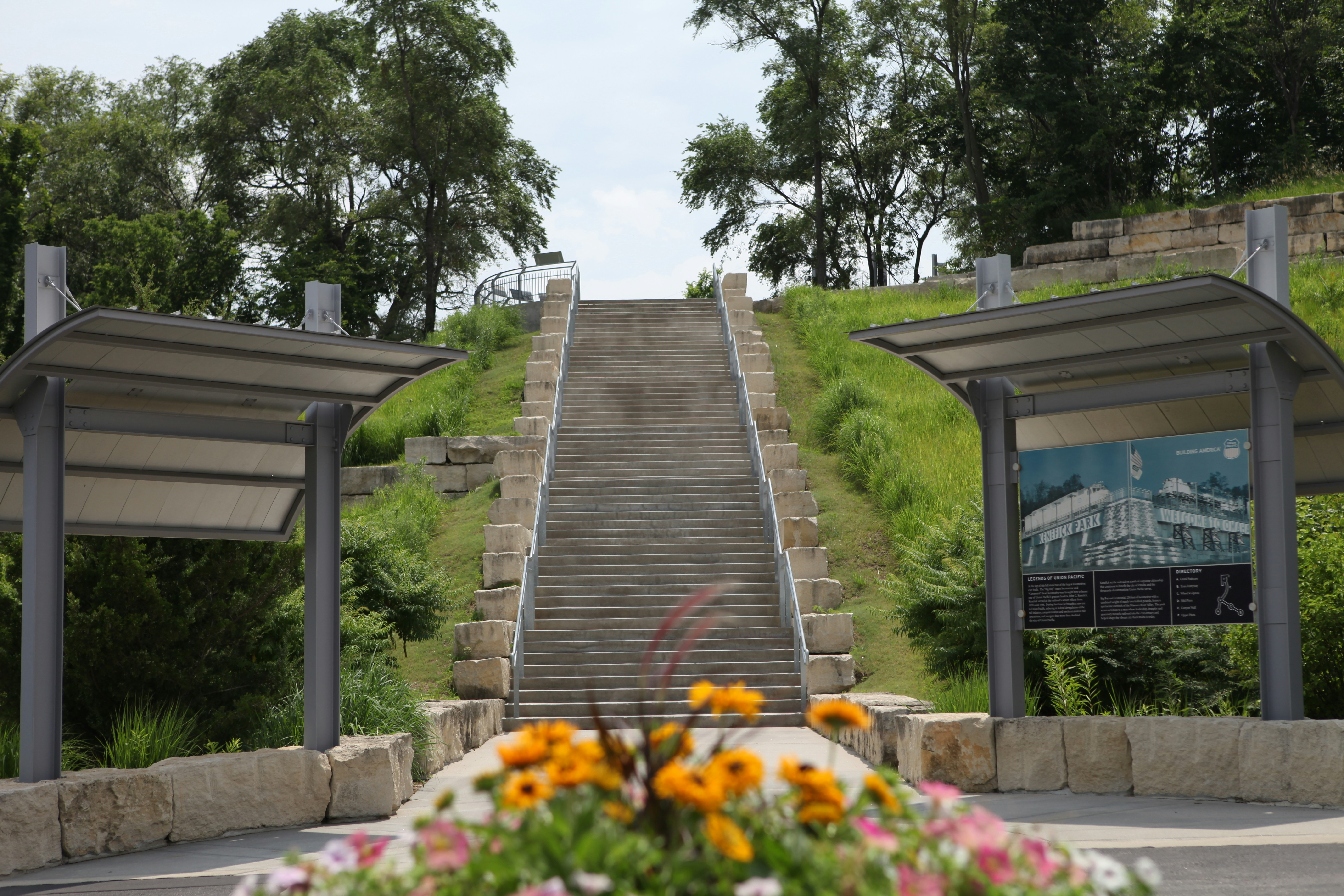 The Quiet Ascent: Stone Staircase Framed by Spring Blooms