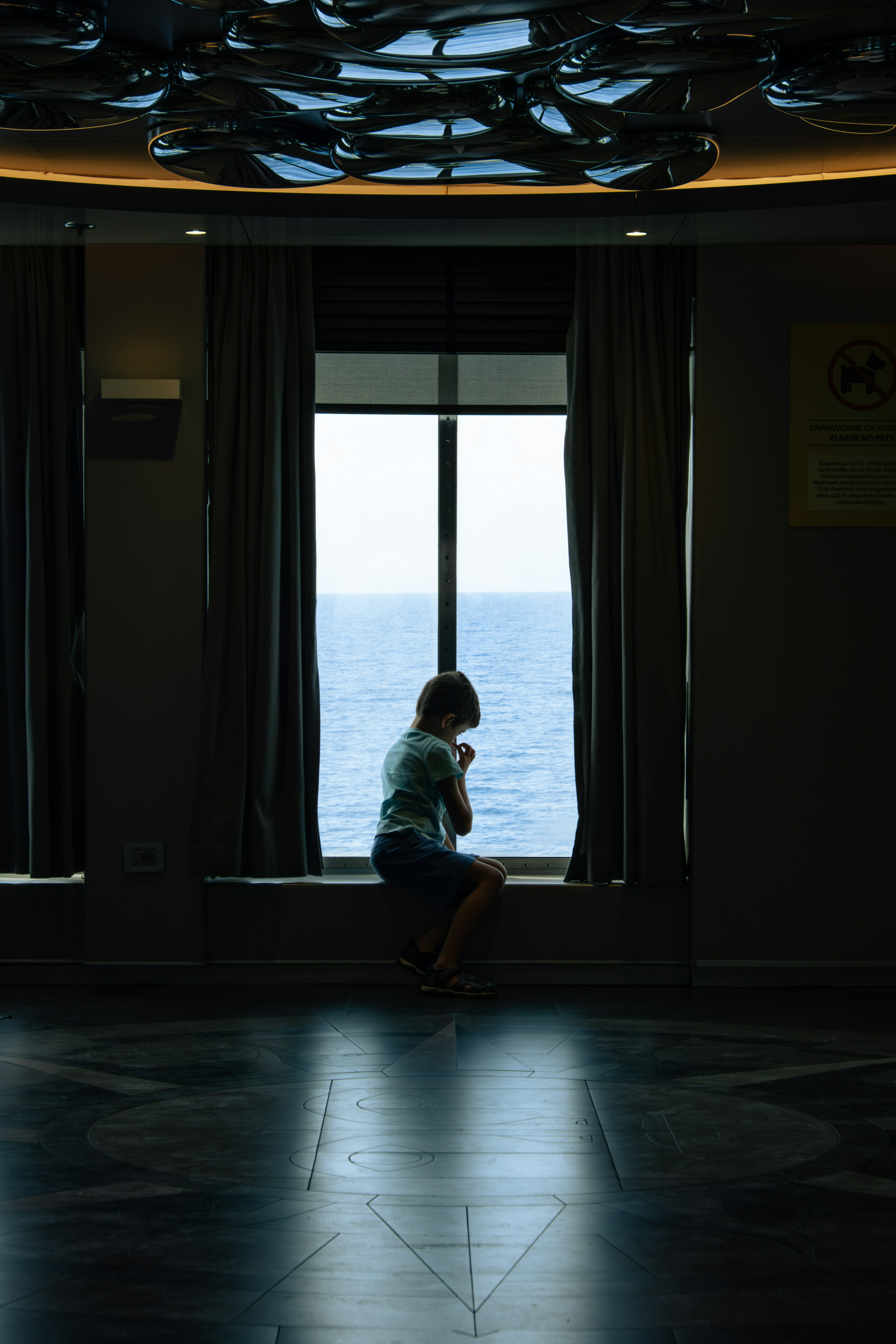 Sea Window Solitude: A Quiet Moment on the Maritime View