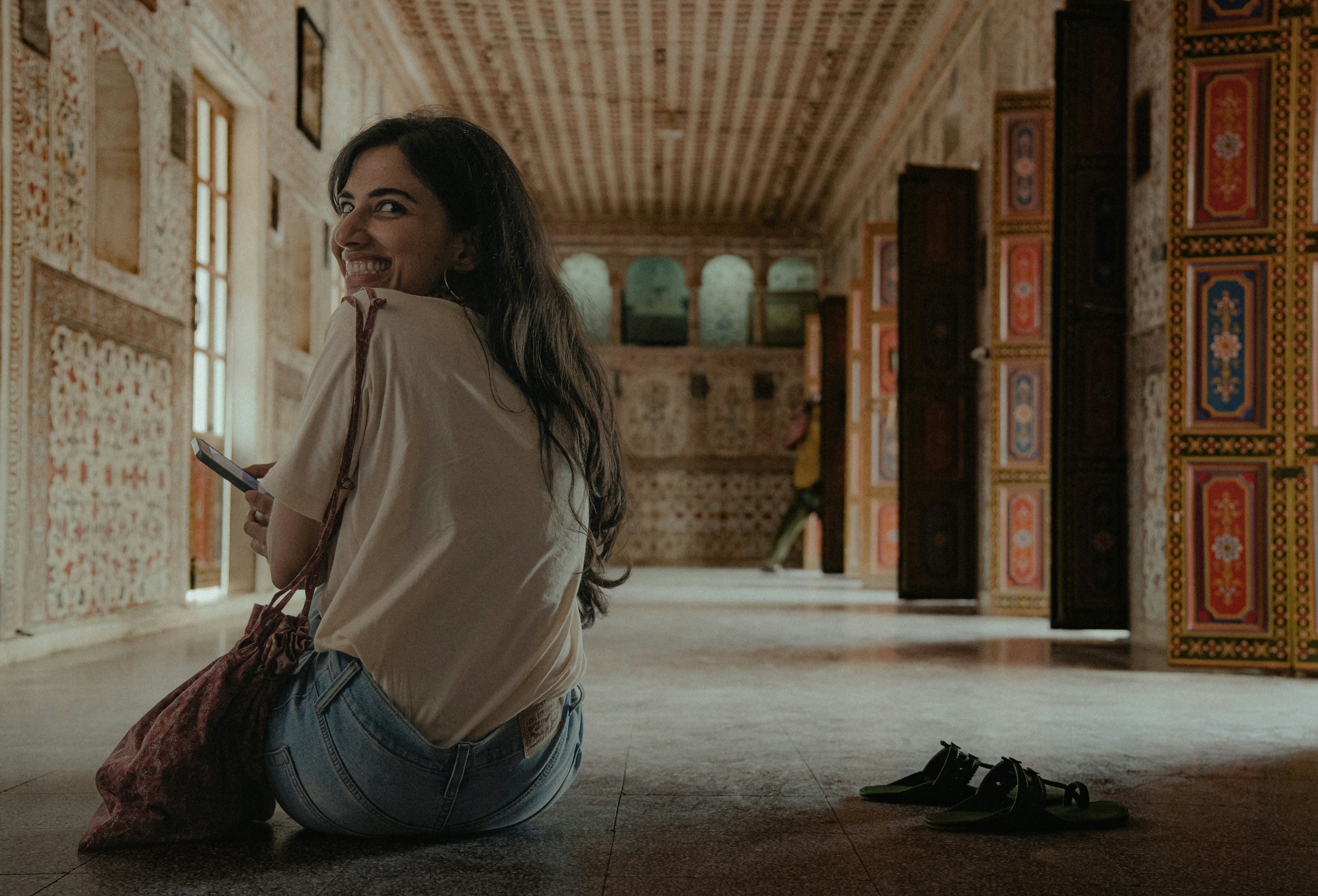 A Quiet Smile in a Patterned Corridor