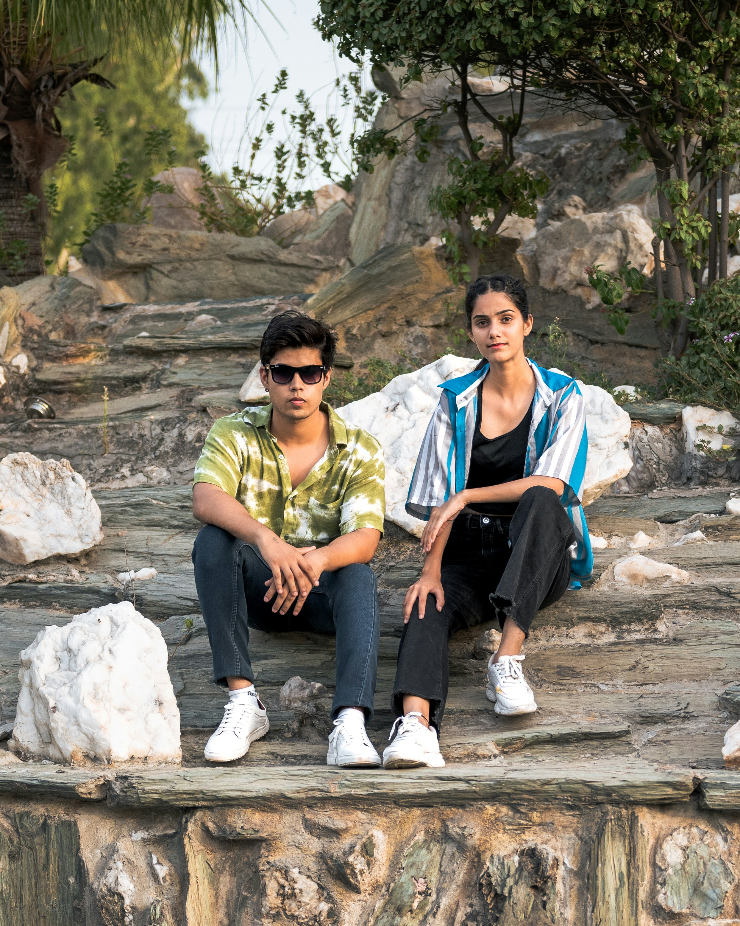 Dappled Light on Rustic Stone Steps: Two Friends in Casual Style