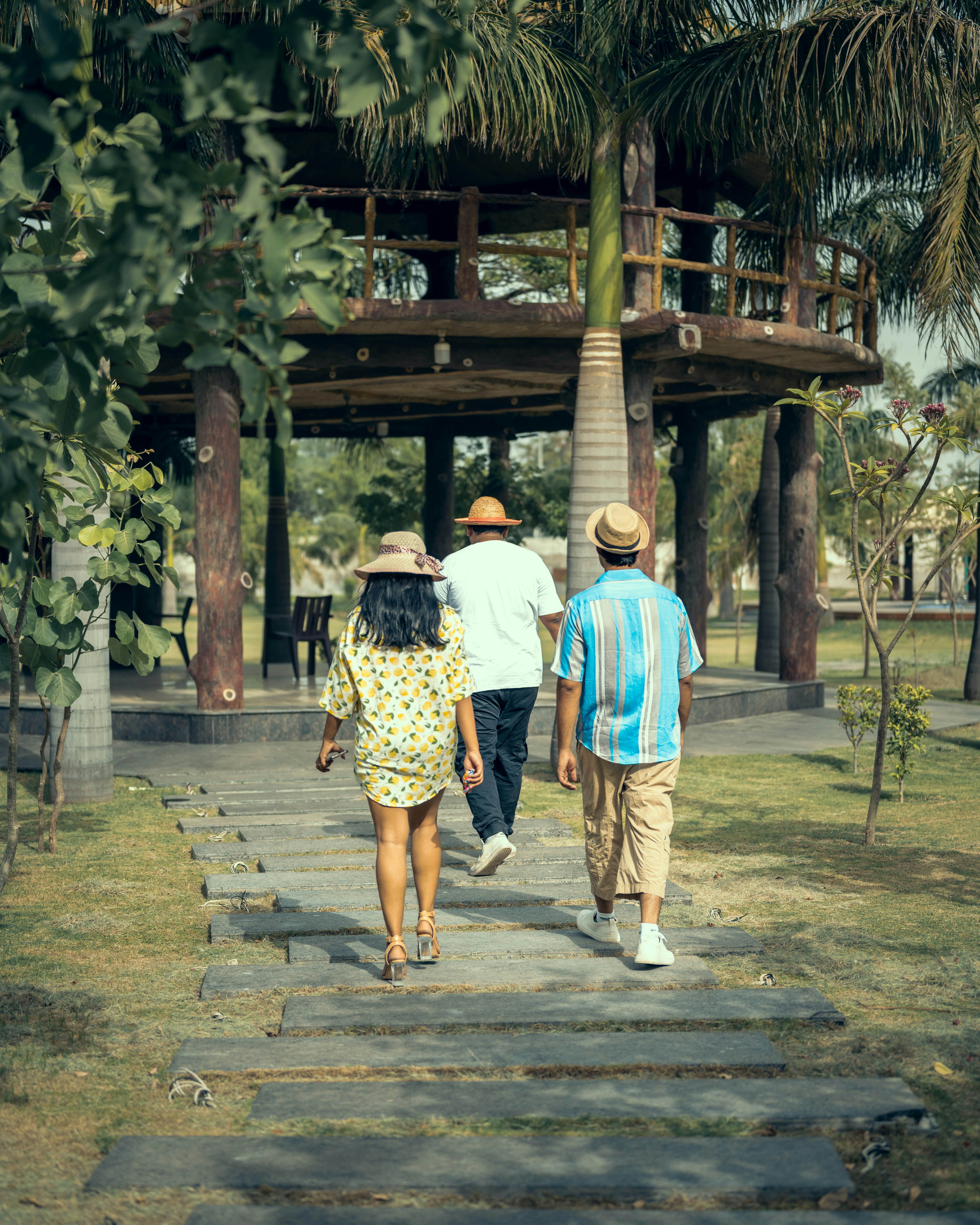 A group of people walking down a pathway photo – Free Walking Image on ...