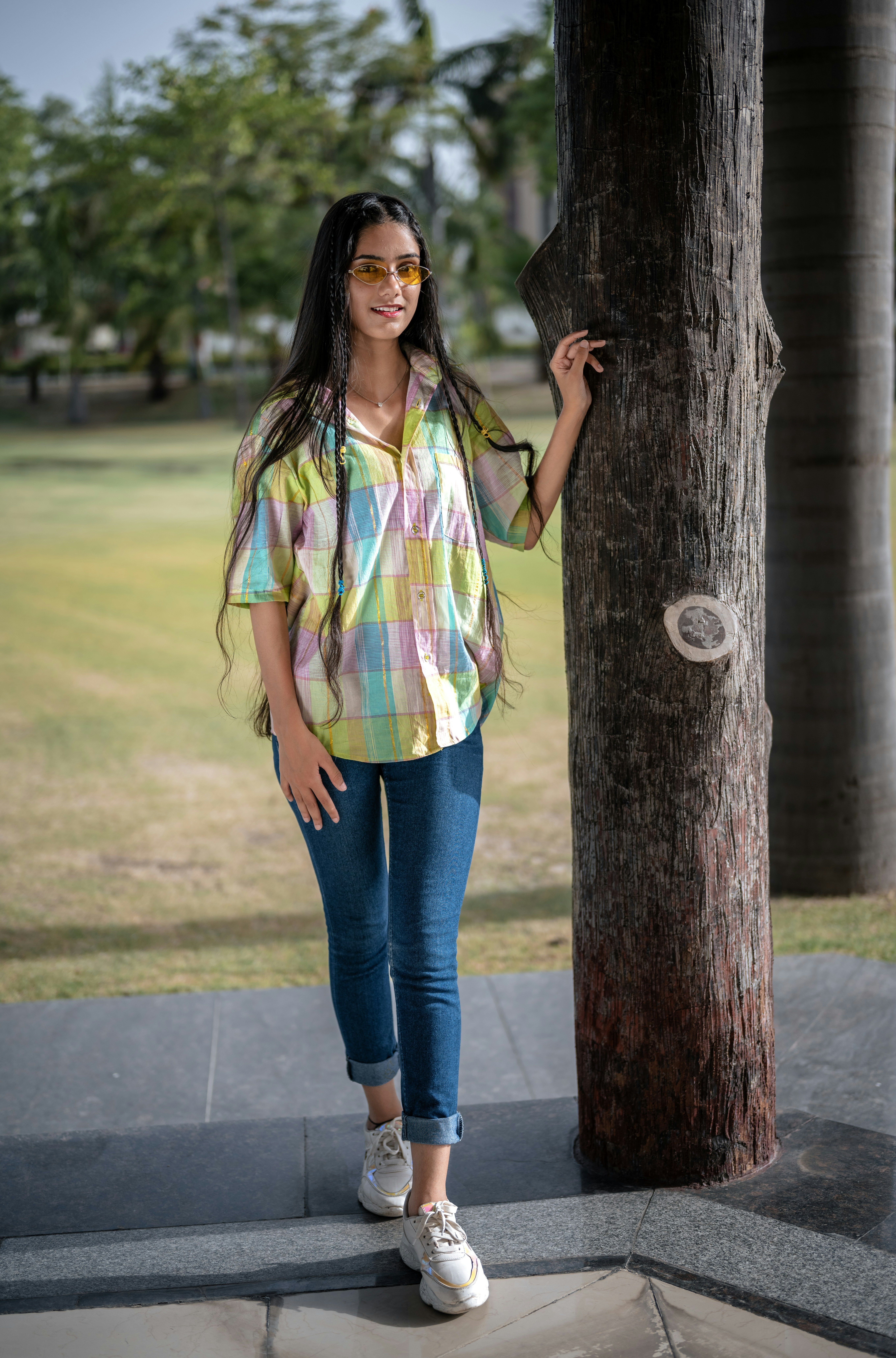 Pastel Plaid Portrait: Sunlit Park Moment by the Tree