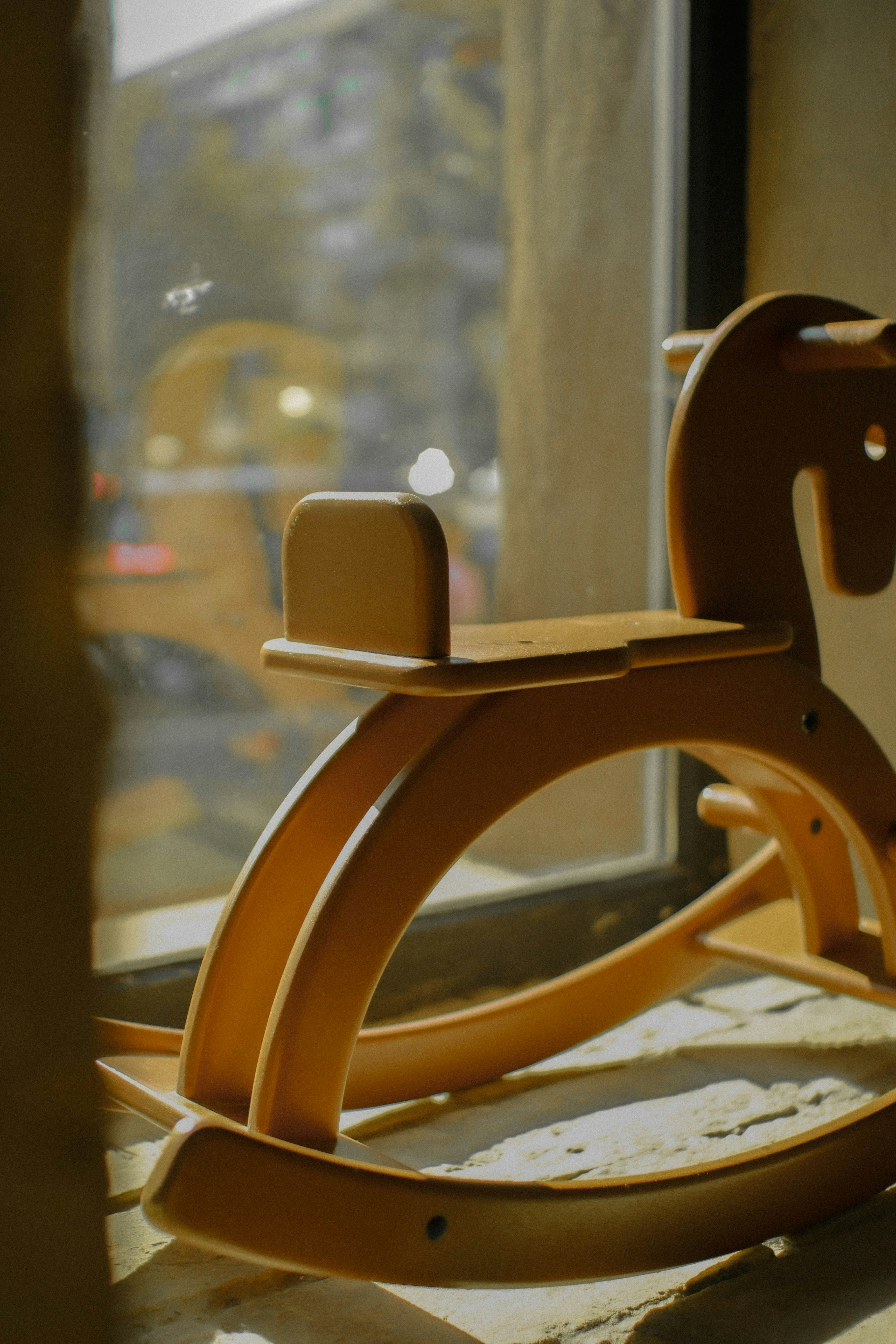 Warm-Orange Wooden Structure Resting by a Sunny Window
