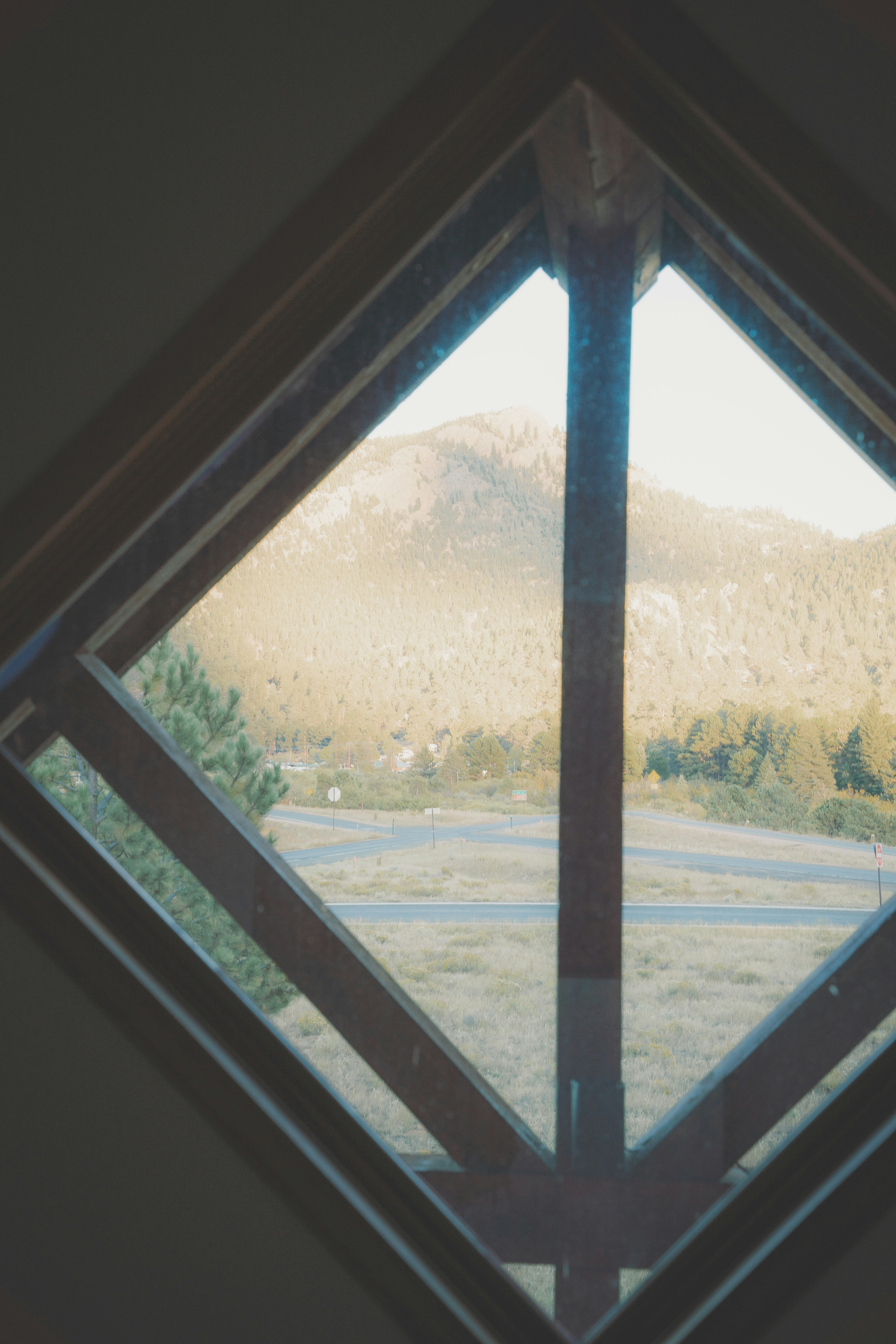 A view of a mountain through a window photo – Free Window Image on Unsplash