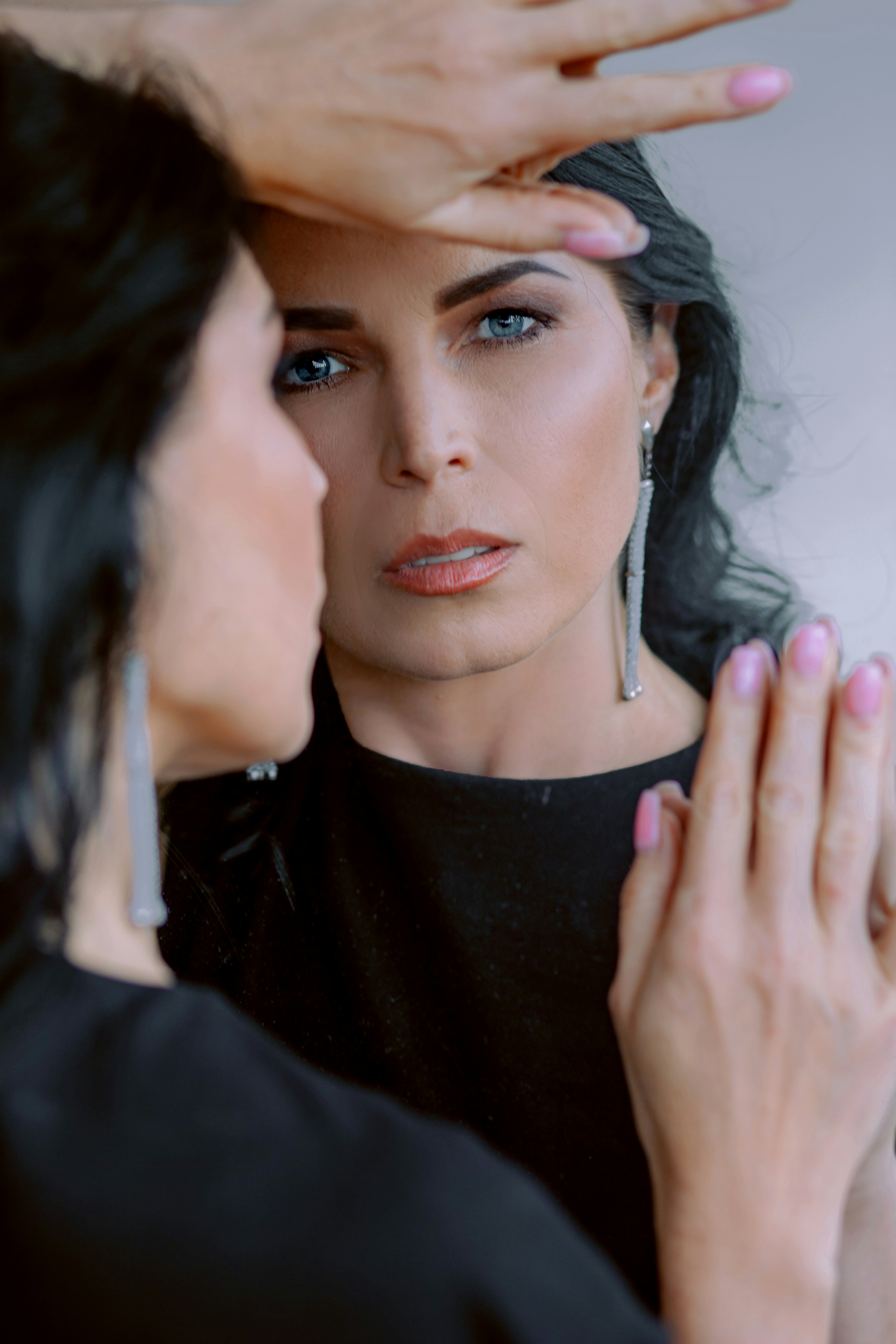 A woman is putting her hands on her head photo – Free Adult Image on ...