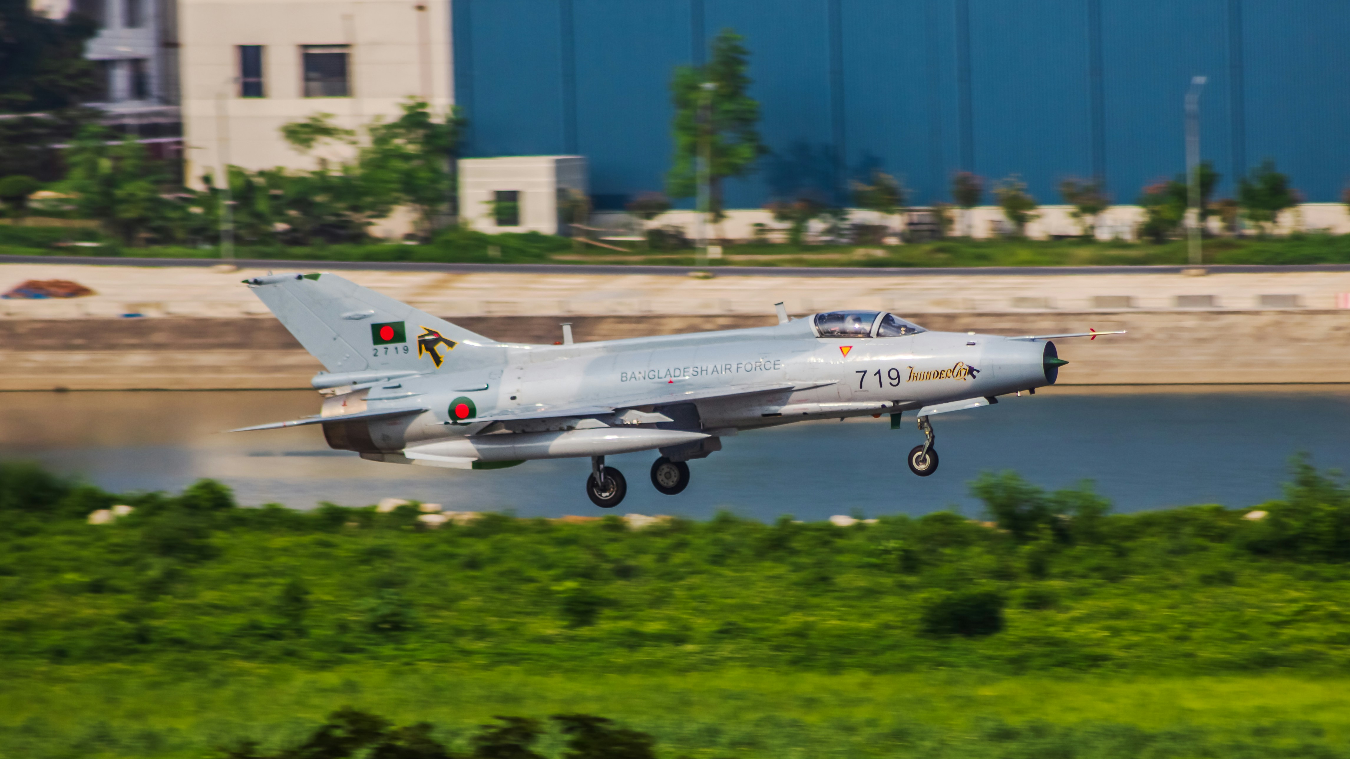 A fighter jet taking off from an airport runway photo – Free Baf Image ...