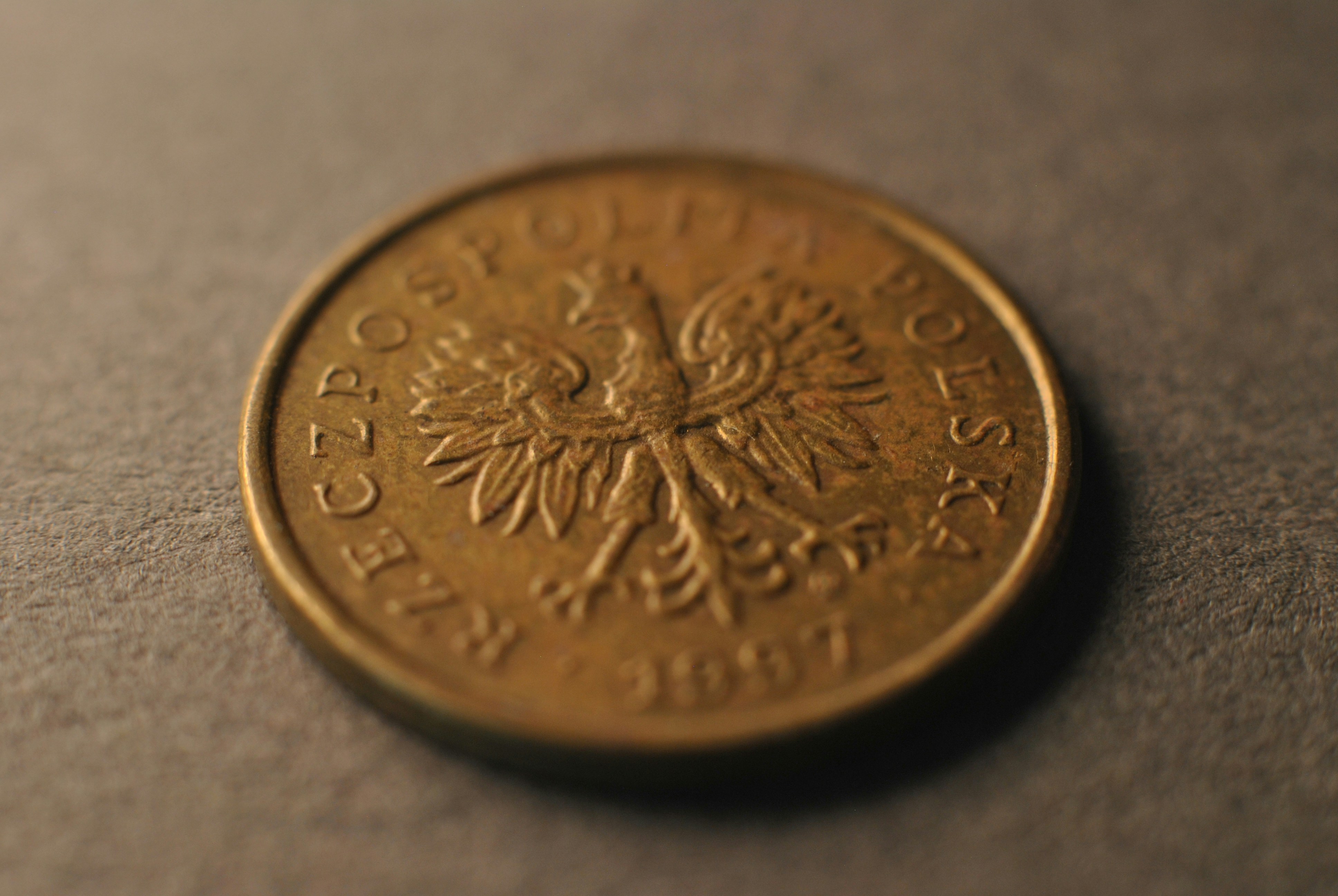 A close up of a coin on a table photo – Free Money Image on Unsplash