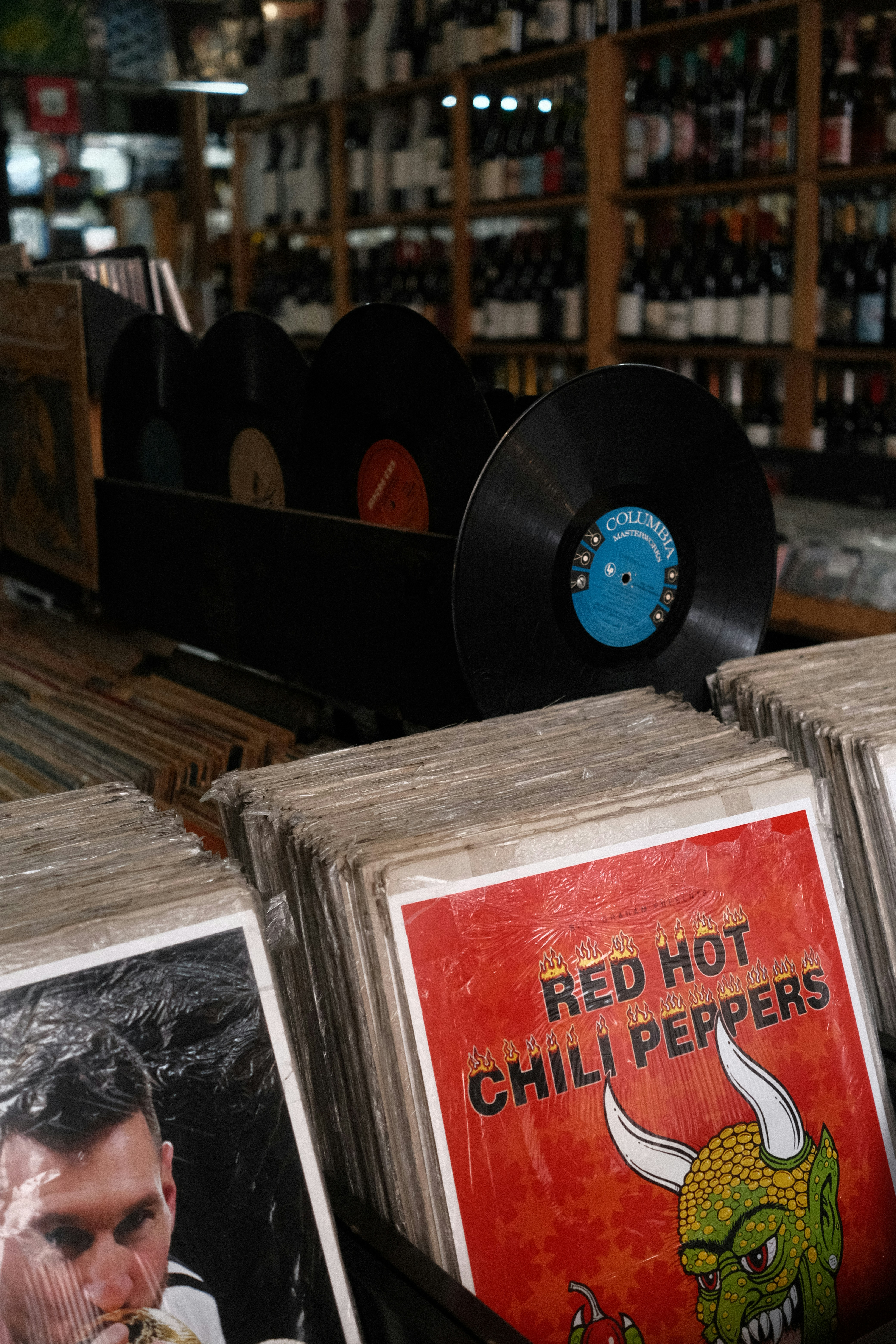 Blue Label Spotlight in a Lively Record Store Aisle