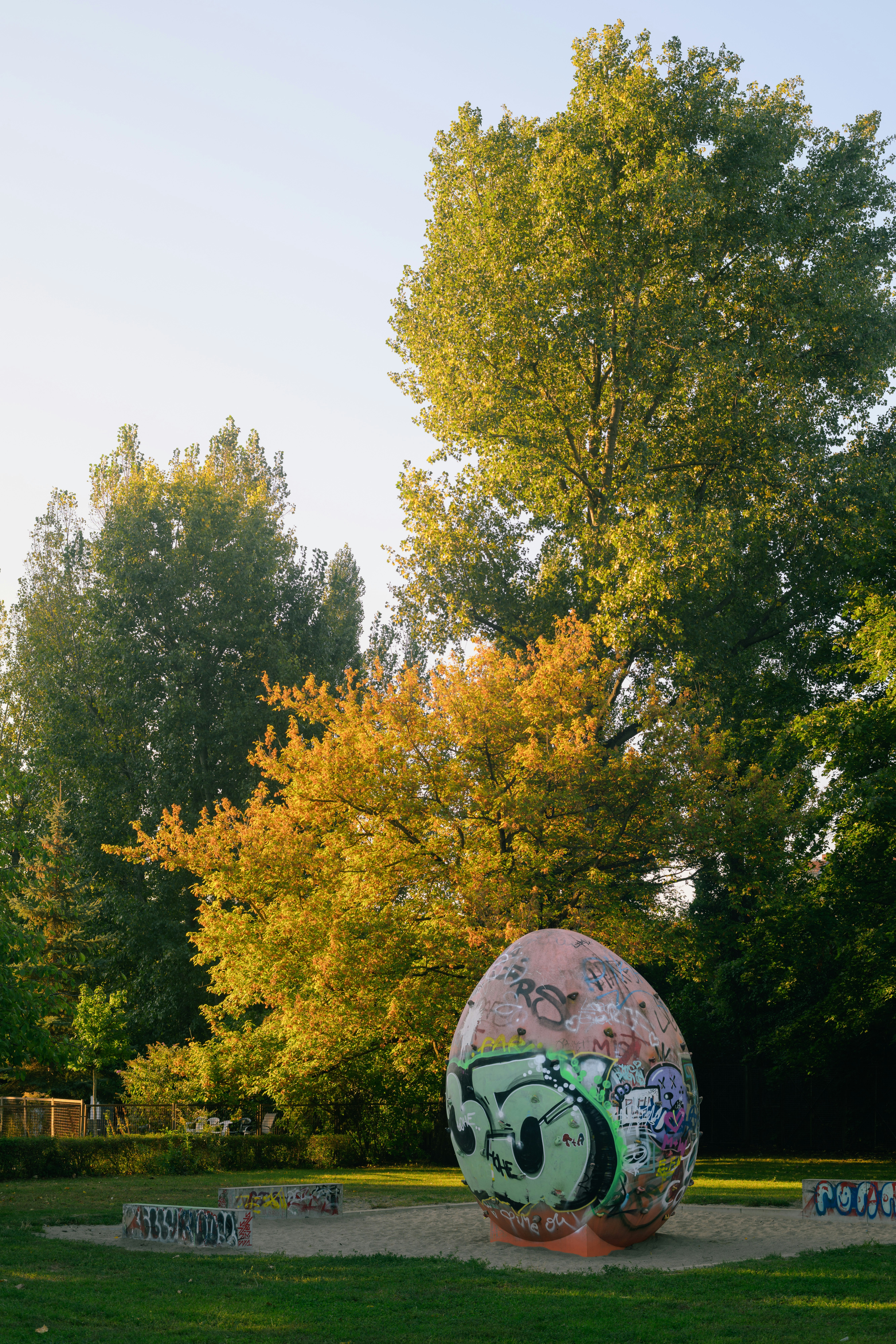 Graffiti Egg in a Sunlit Autumn Park
