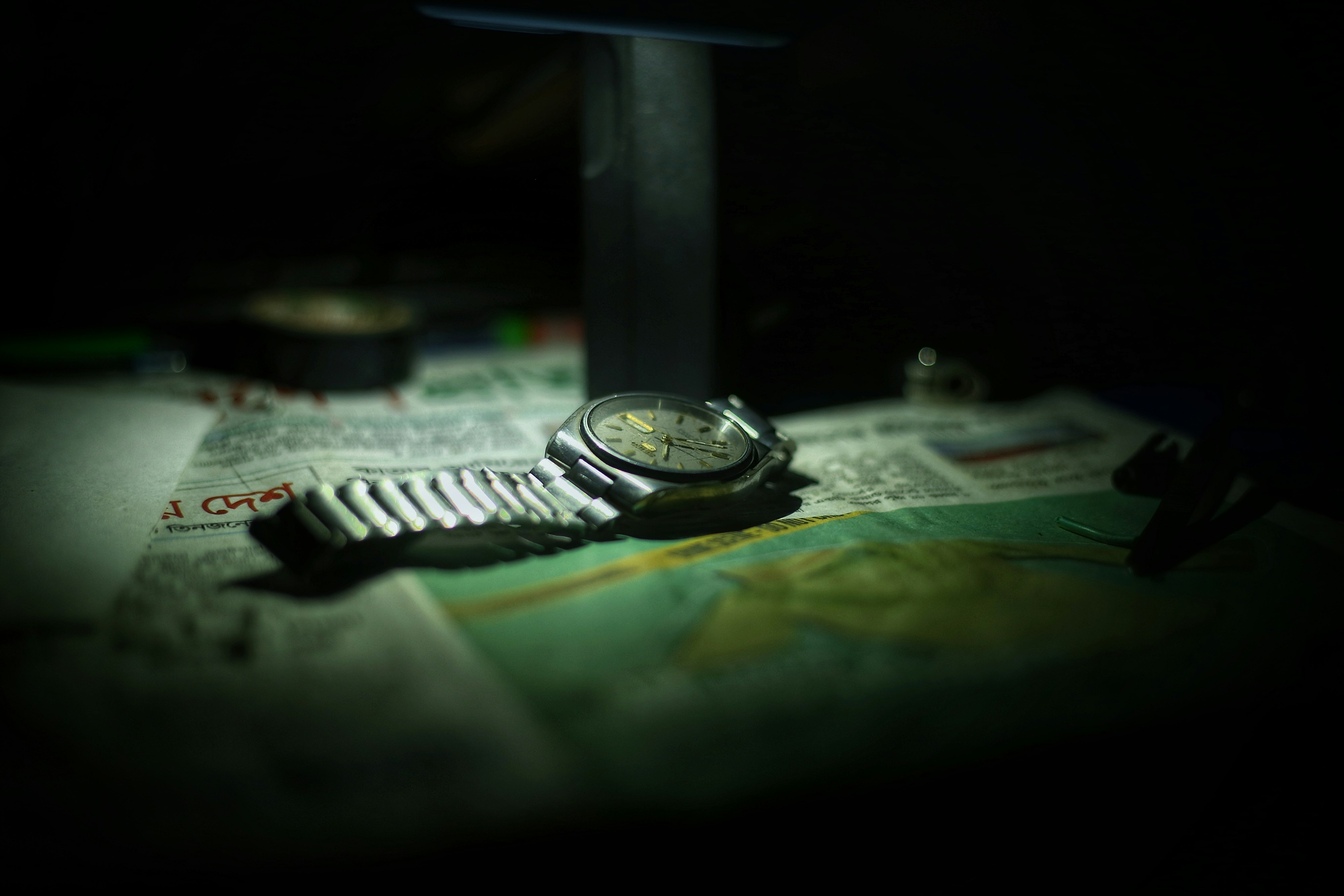 Timepiece in the Spotlight on Weathered Pages