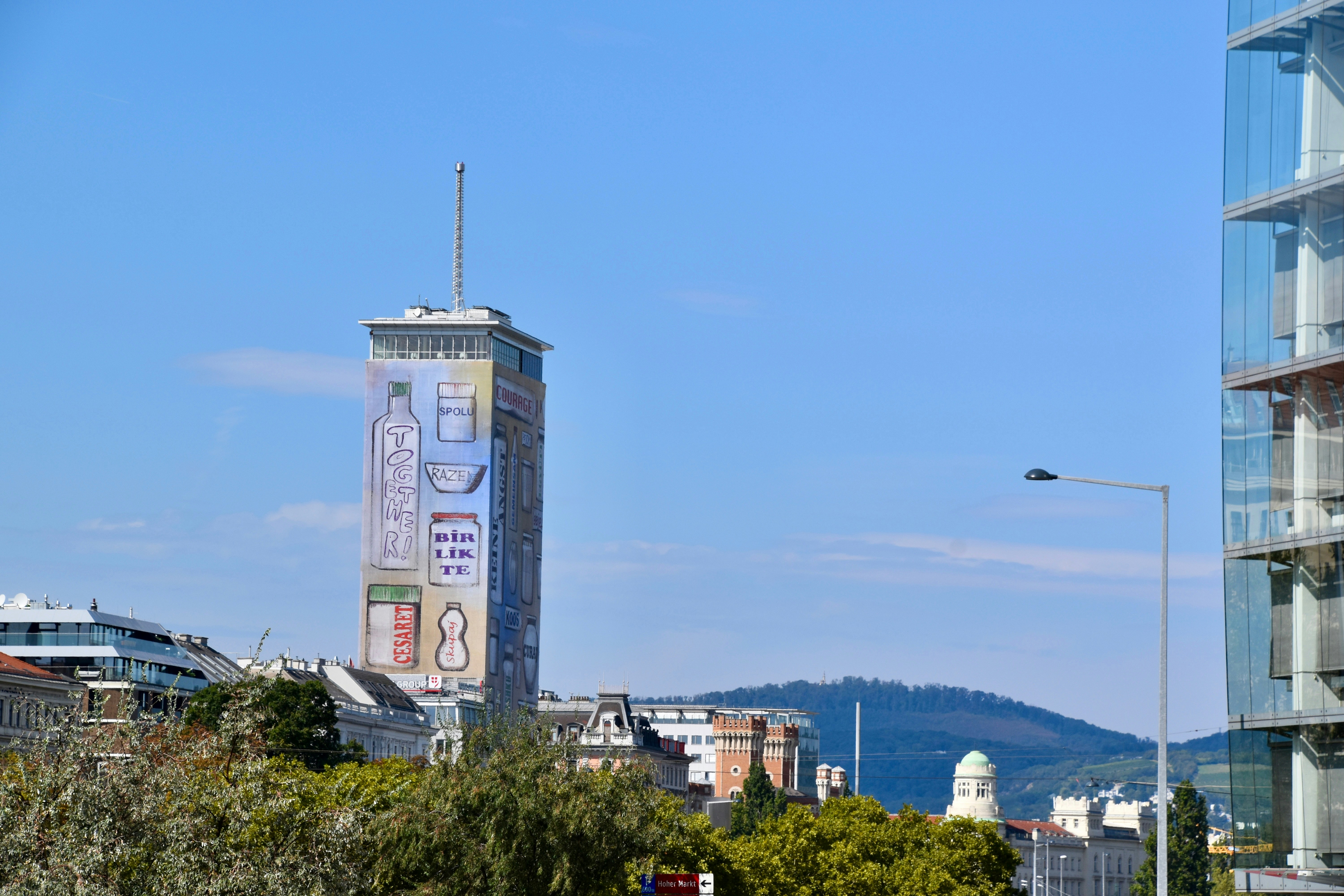 The Billboard Tower Rising Over a Blue-Hazed Cityscape