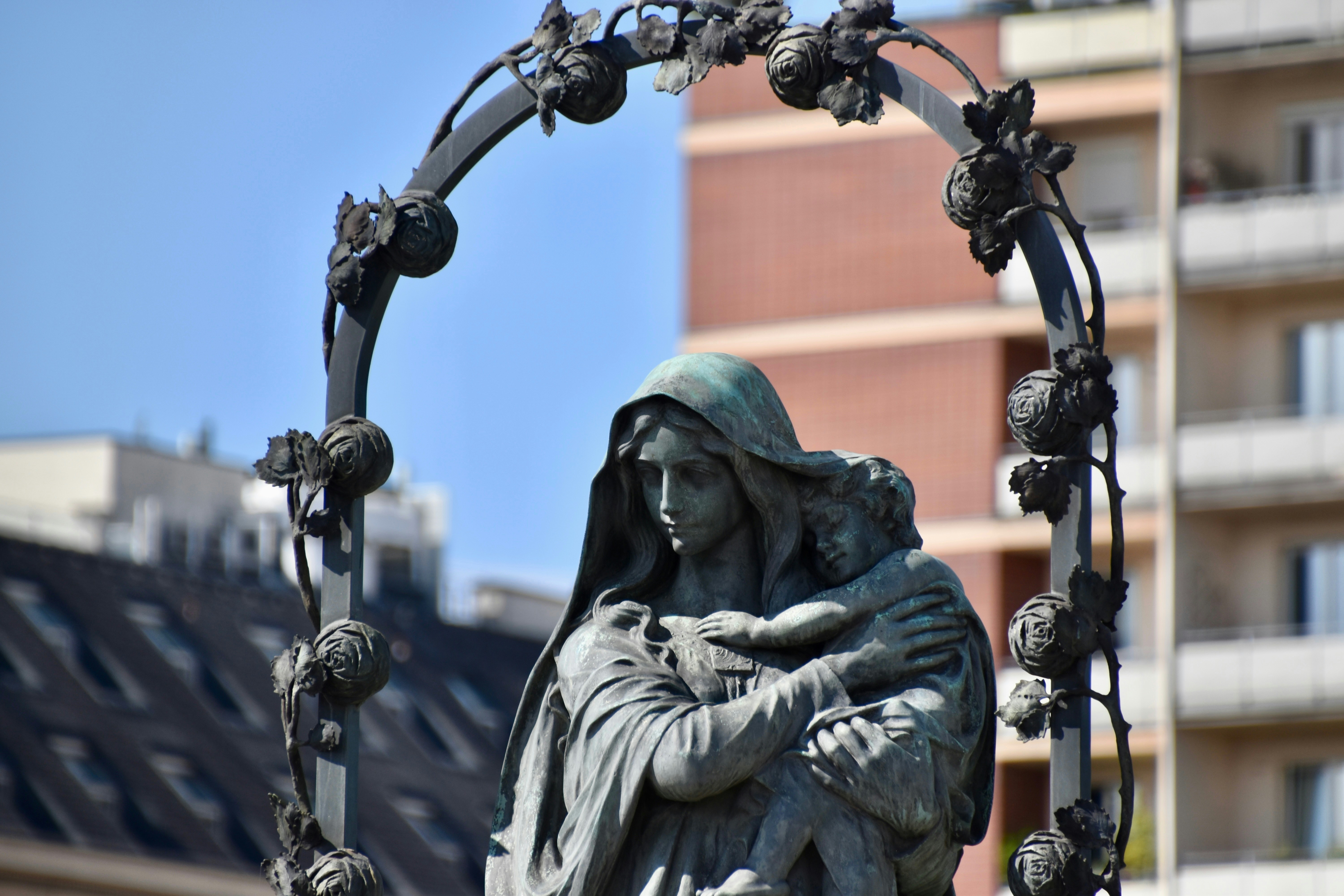 Solace in a Ring of Roses: A City Statue in Focus