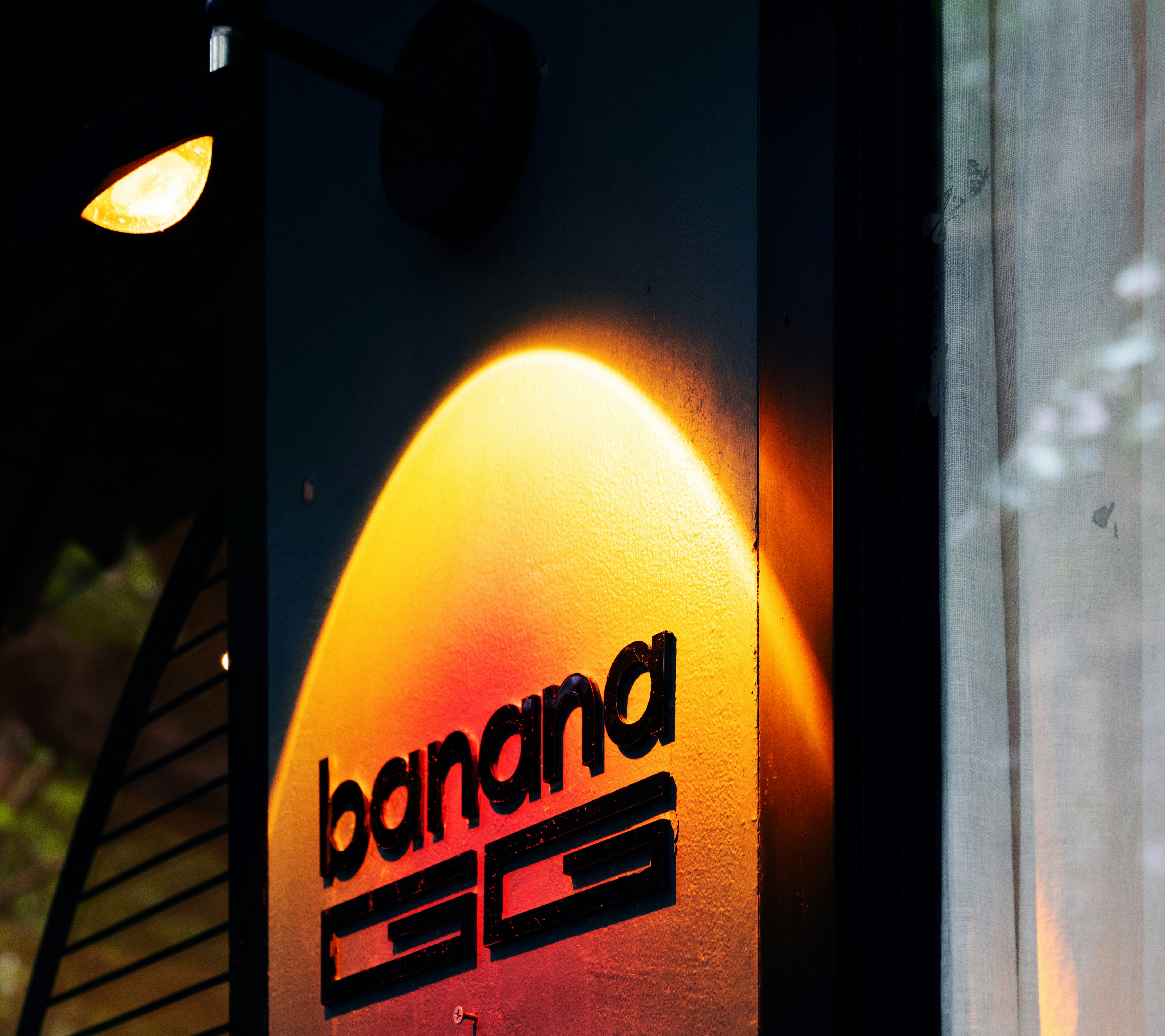 Amber Halo on a Storefront Sign: Close-Up of a Warm Logo