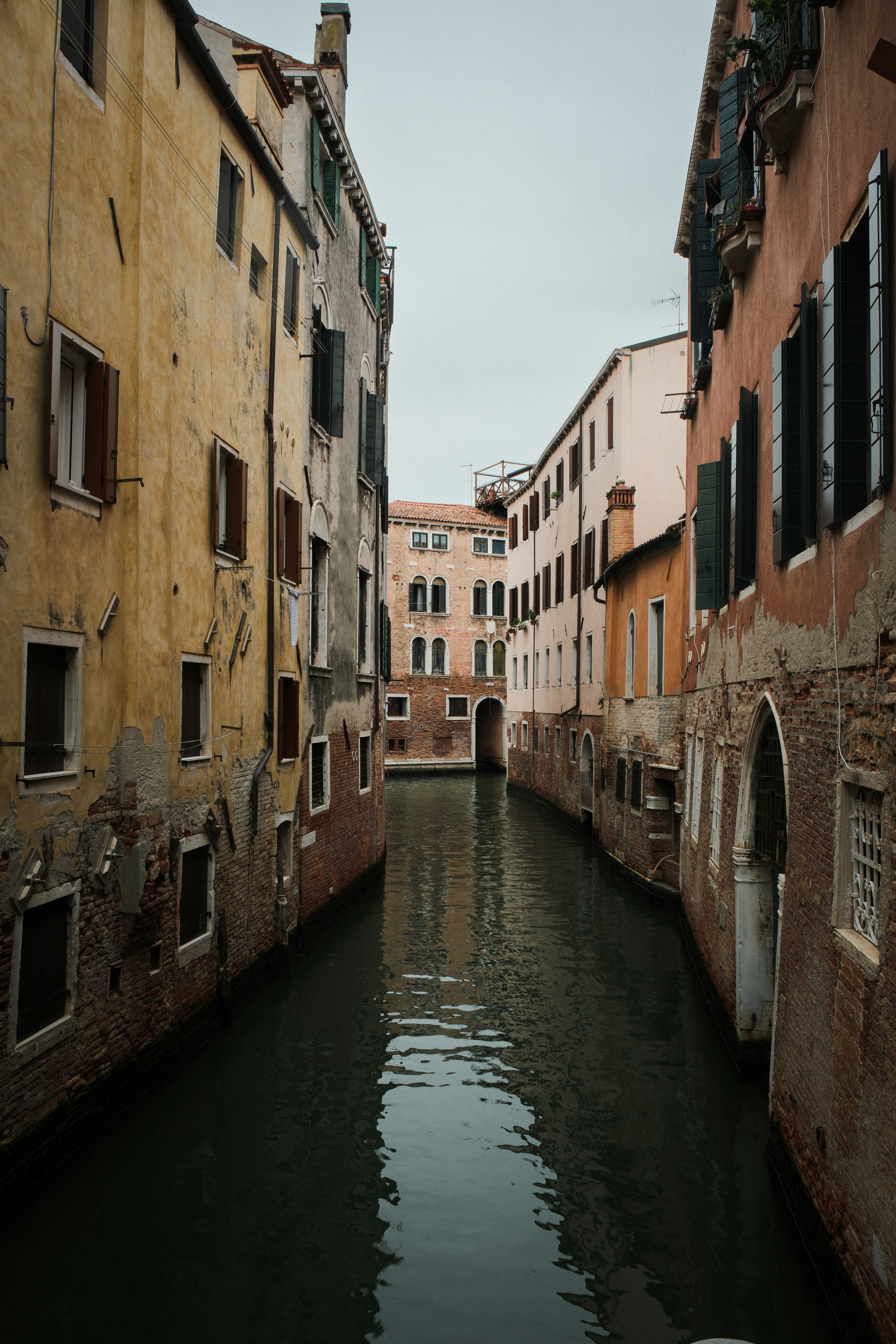 Canals of Venice, Italy | A narrow canal running between two buildings in a city
