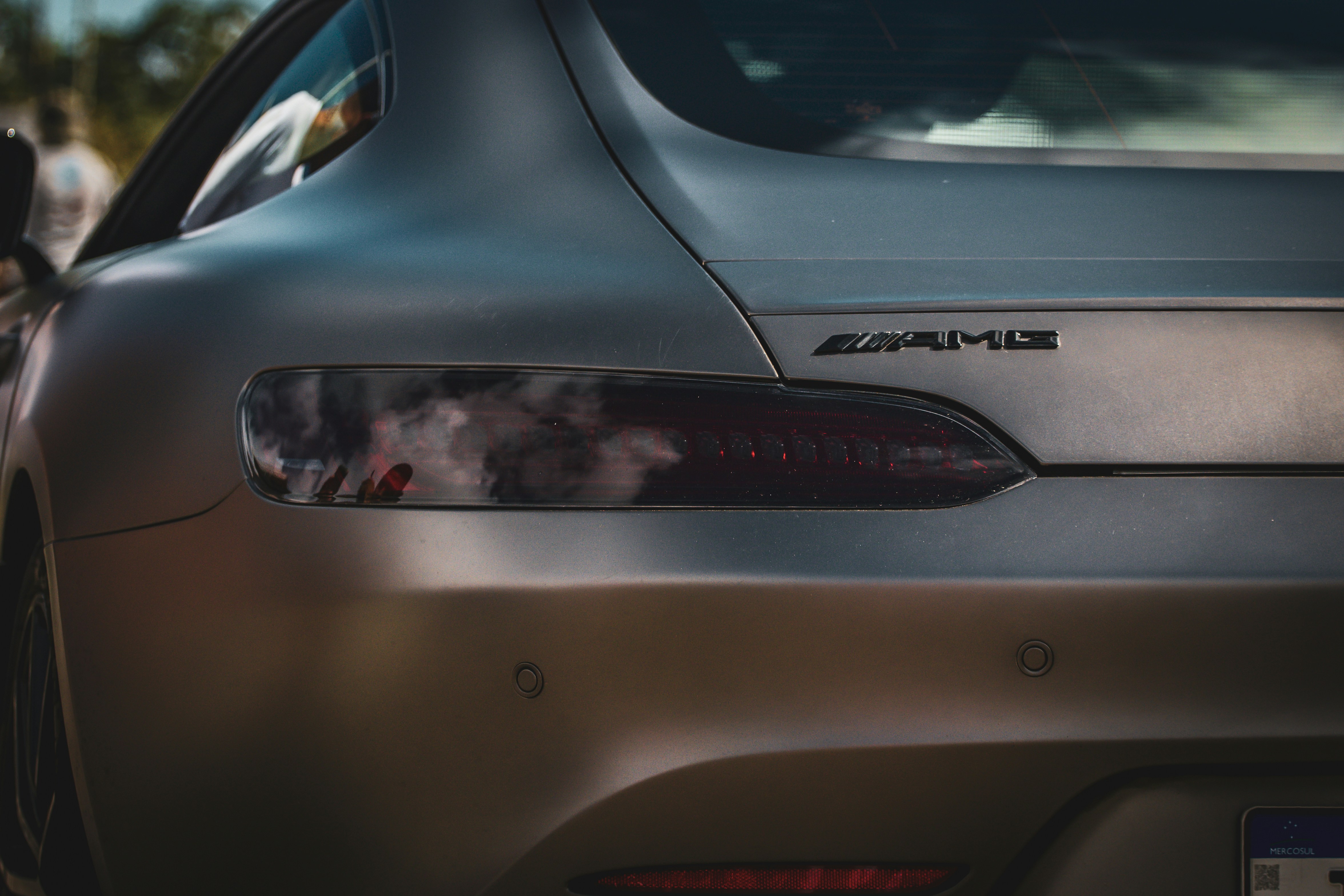 Matte Midnight: AMG rear silhouette with sculpted curvature.