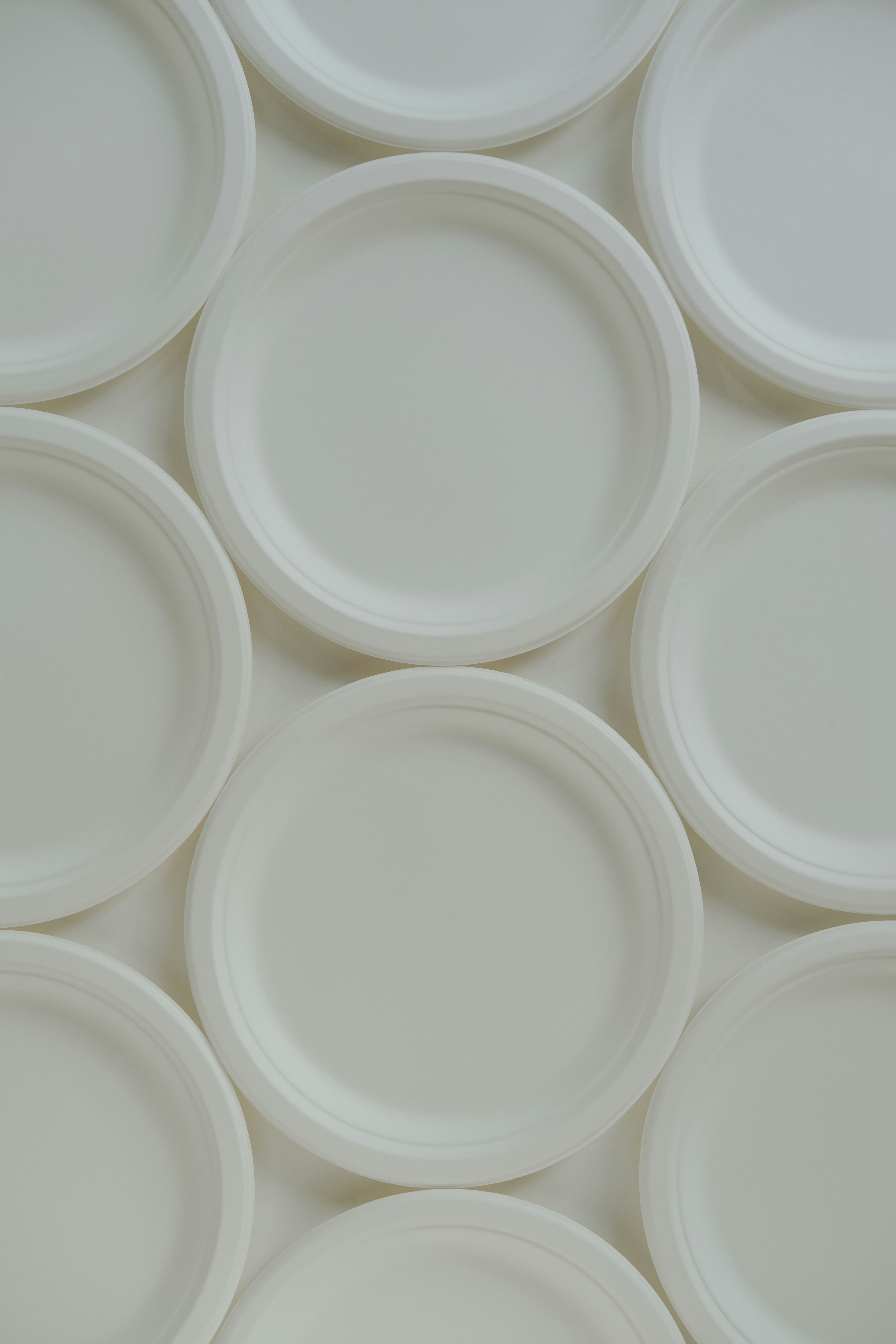 A group of white plates sitting on top of each other photo – Free ...