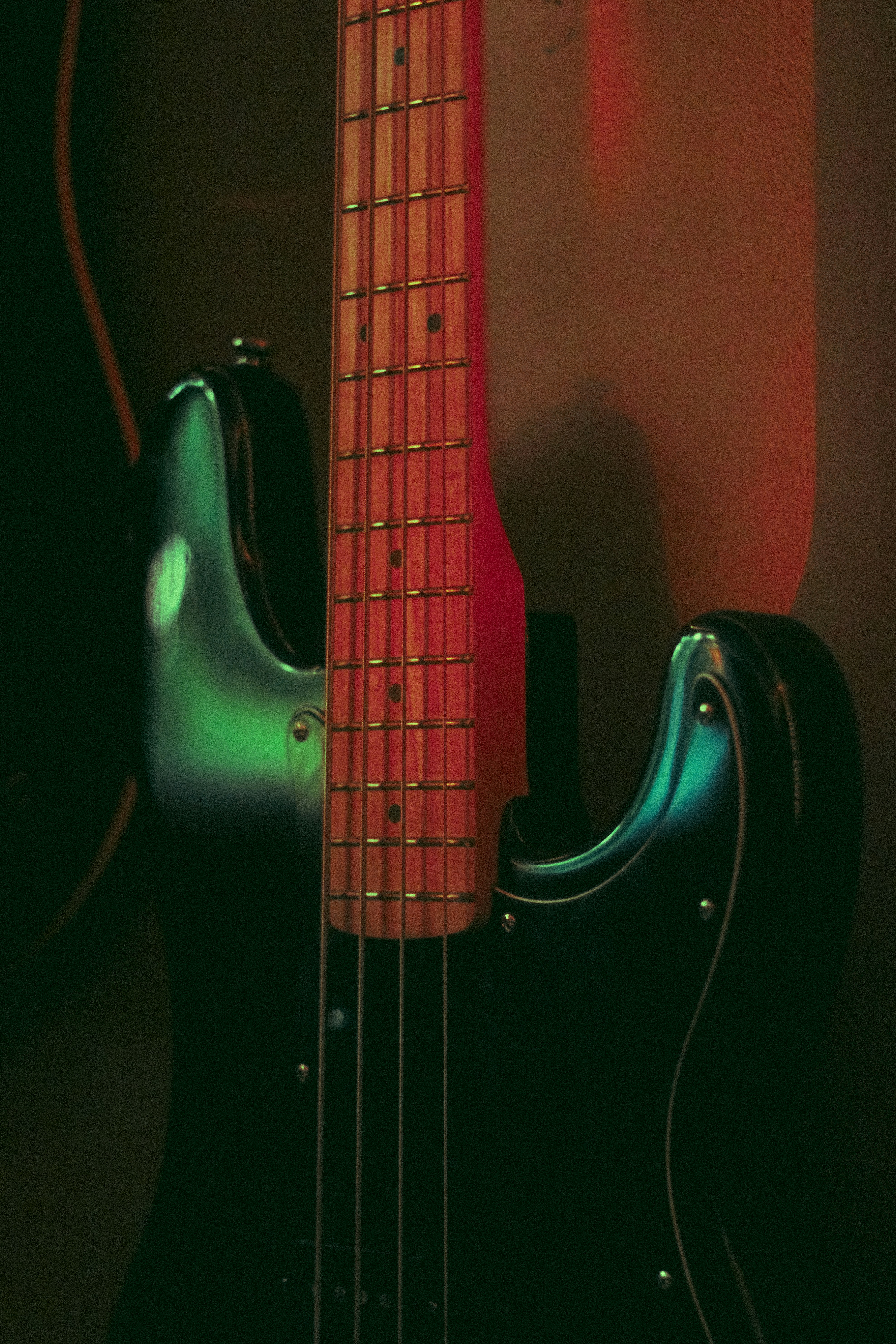 Neon-Neck in Focus: Moody Close-Up of an Electric Guitar