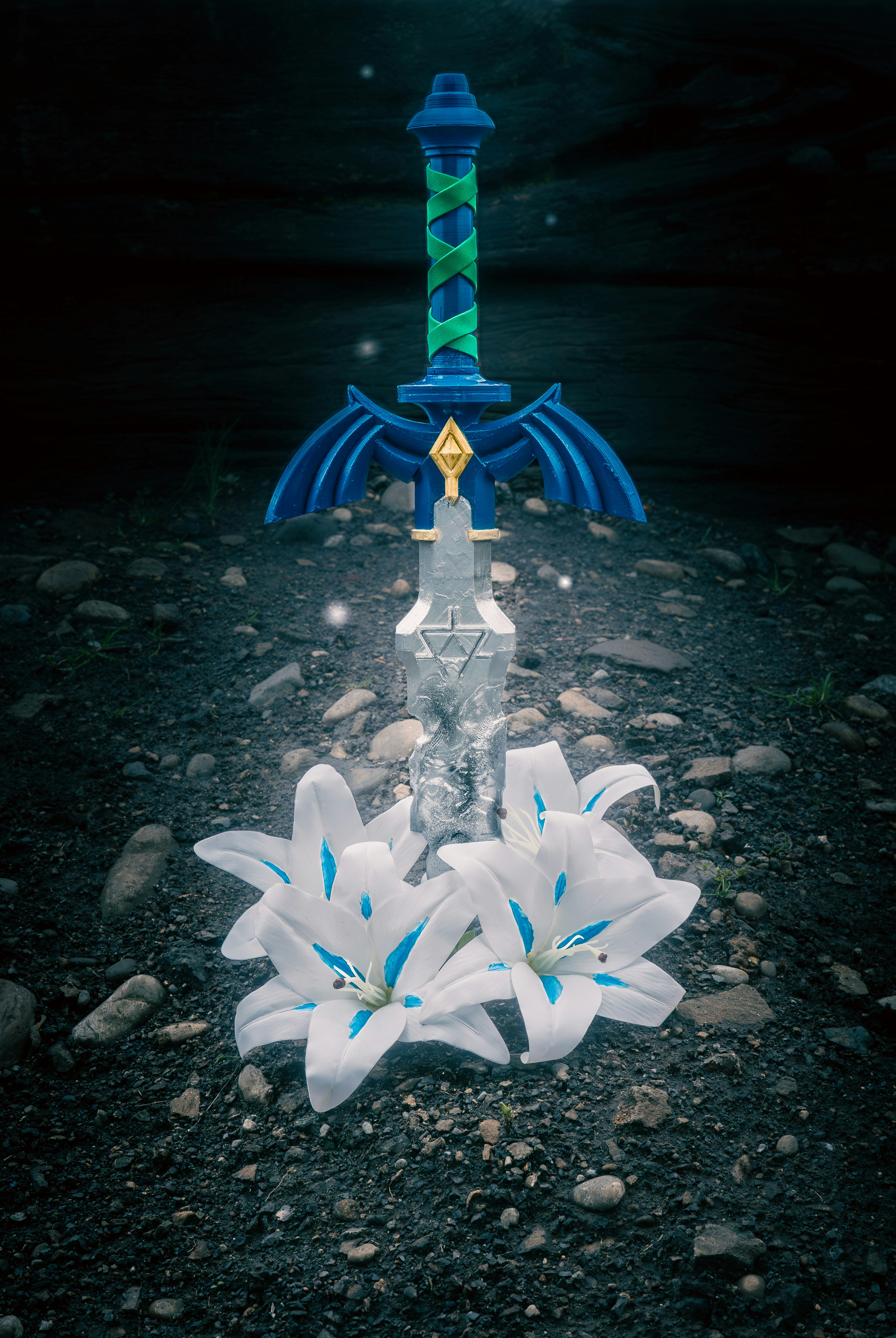A blue and green dragon sword and some white flowers photo – Free ...